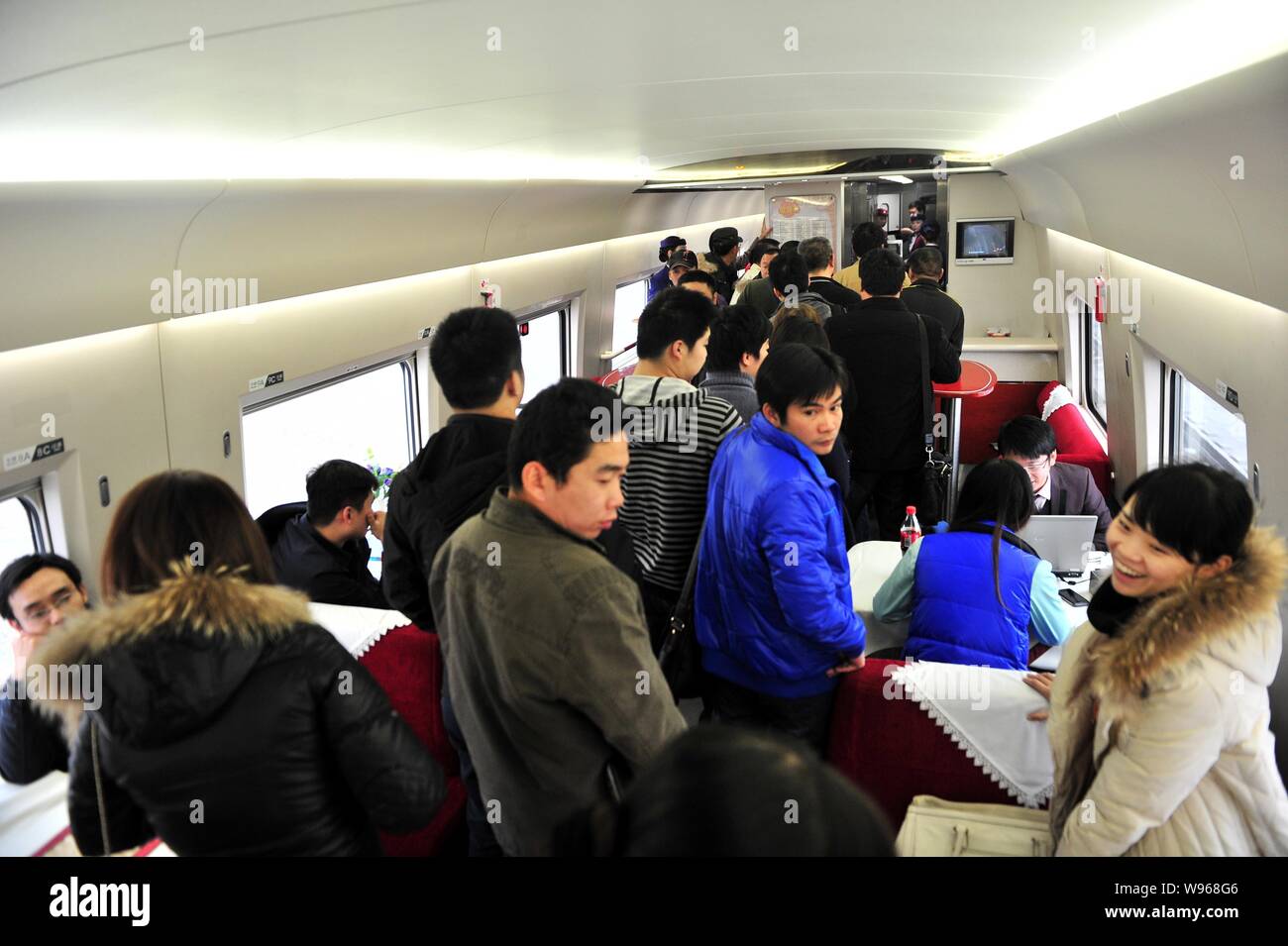 Passengers queue up for their lunch aboard a CRH (China Railway High ...