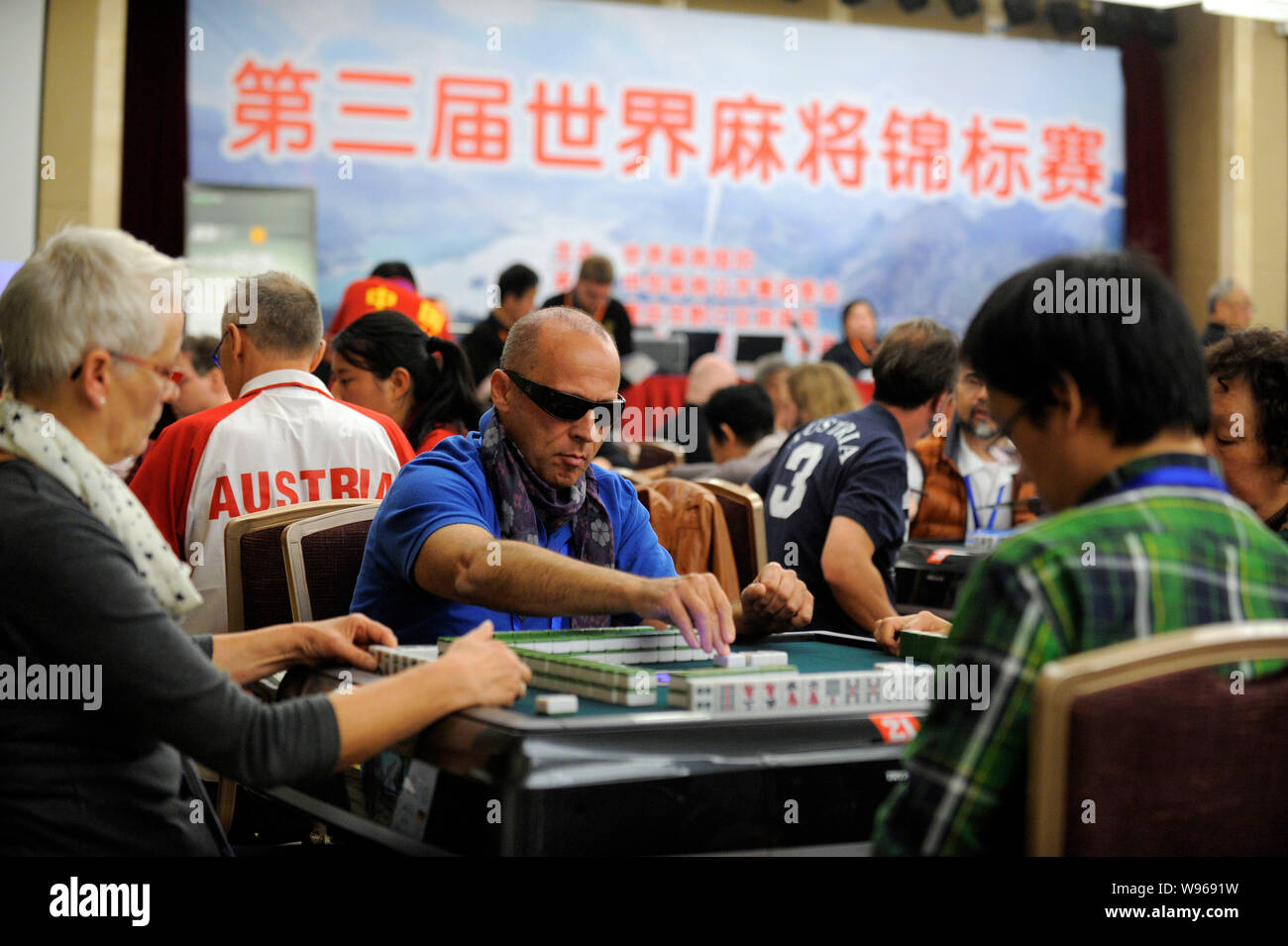 Participants compete during the 3rd World Mahjong Championship in ...