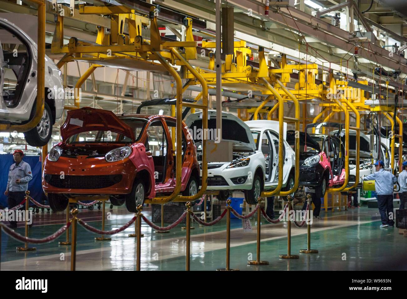 --FILE--Chinese workers assemble cars on the assembly line at the auto ...