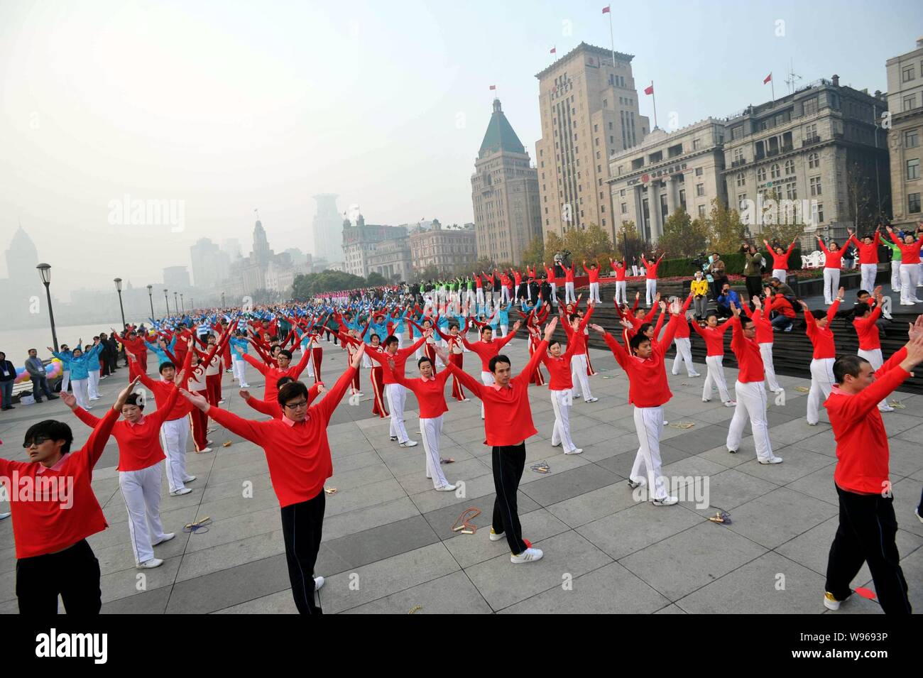 Local Chinese resident do morning exercise during the closing ceremony ...