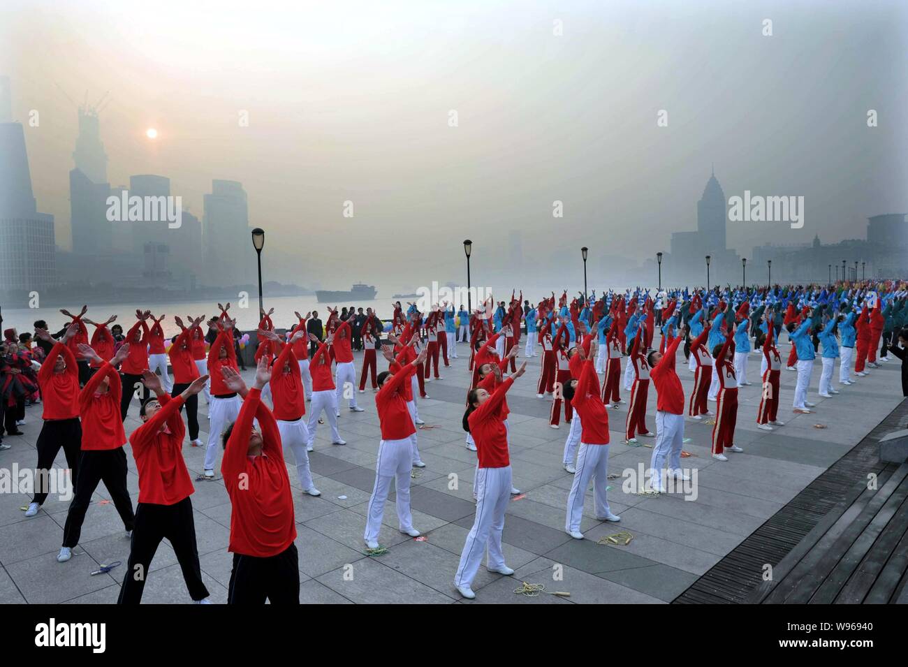 Local Chinese resident do morning exercise during the closing ceremony ...