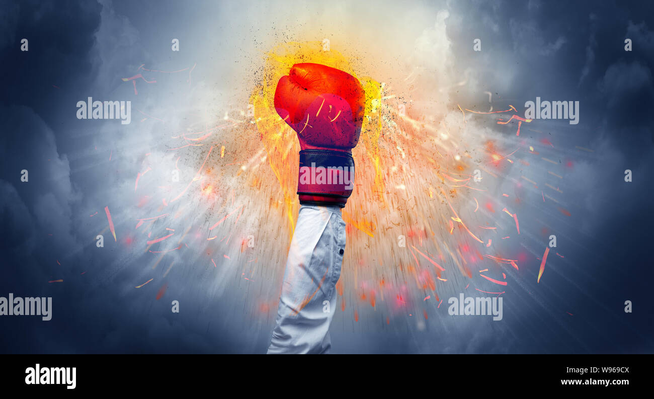 Hand hits strongly and makes fire beam around Stock Photo - Alamy