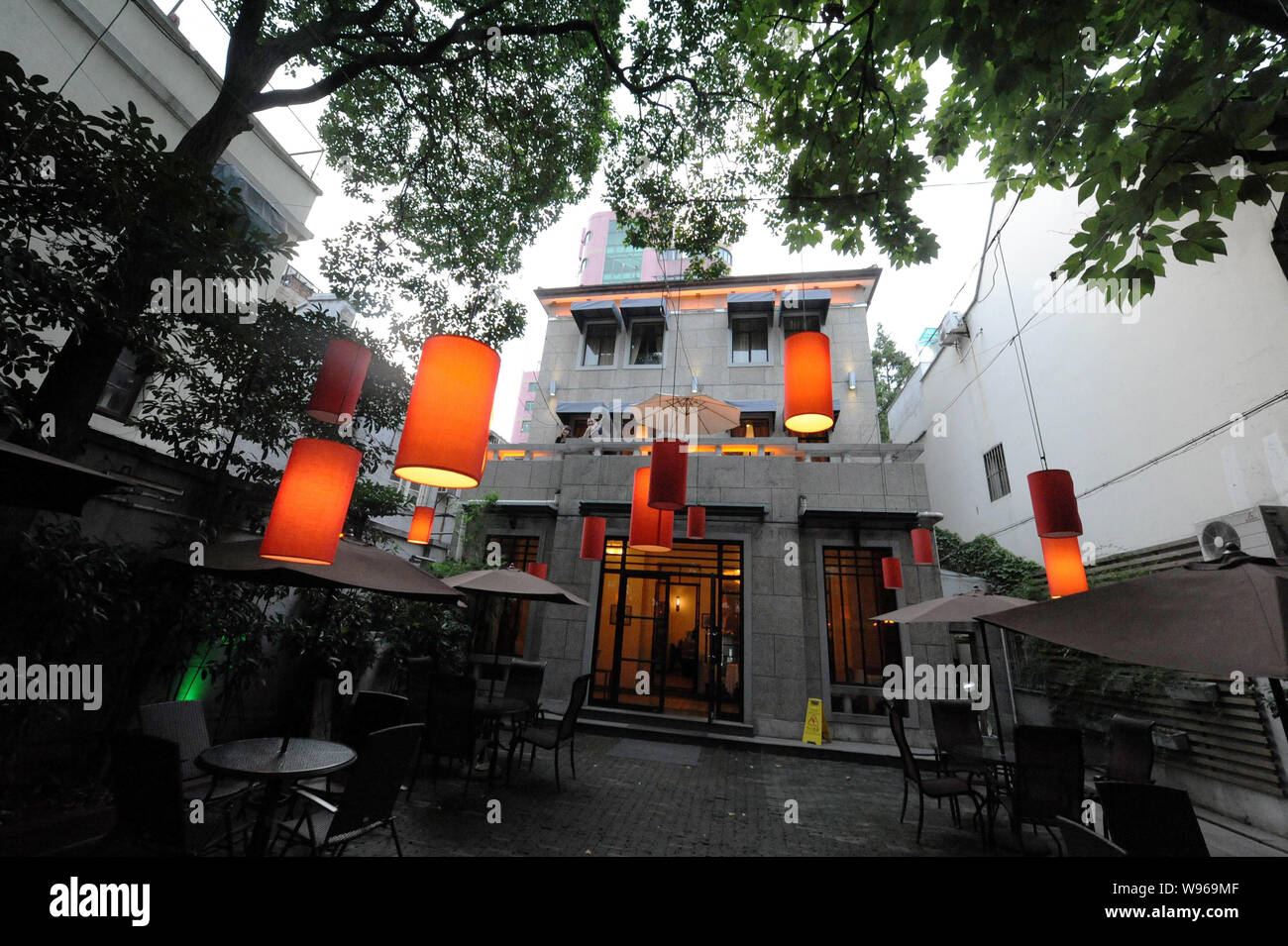 Lights are hung over the courtyard of a restaurant on the Jinxian Road ...