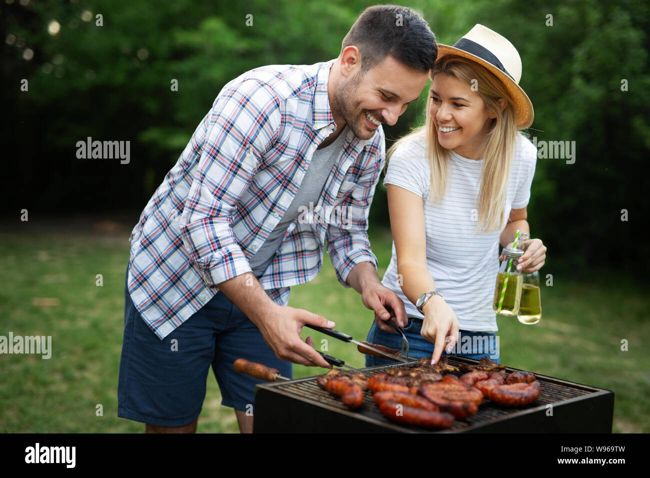 Group of friends having a barbecue party in nature Stock Photo - Alamy