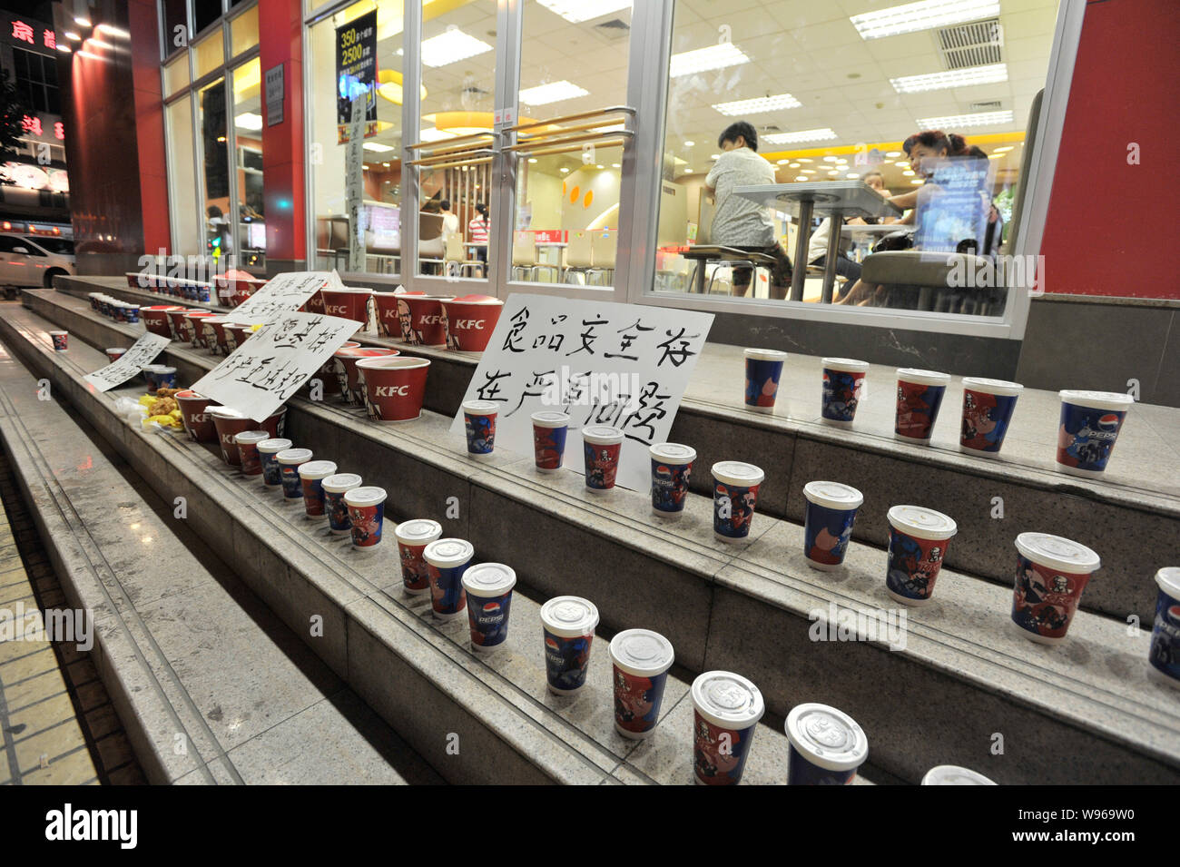 Family Big Boxes and cups of Pepsi cola are lined up in front of a KFC ...