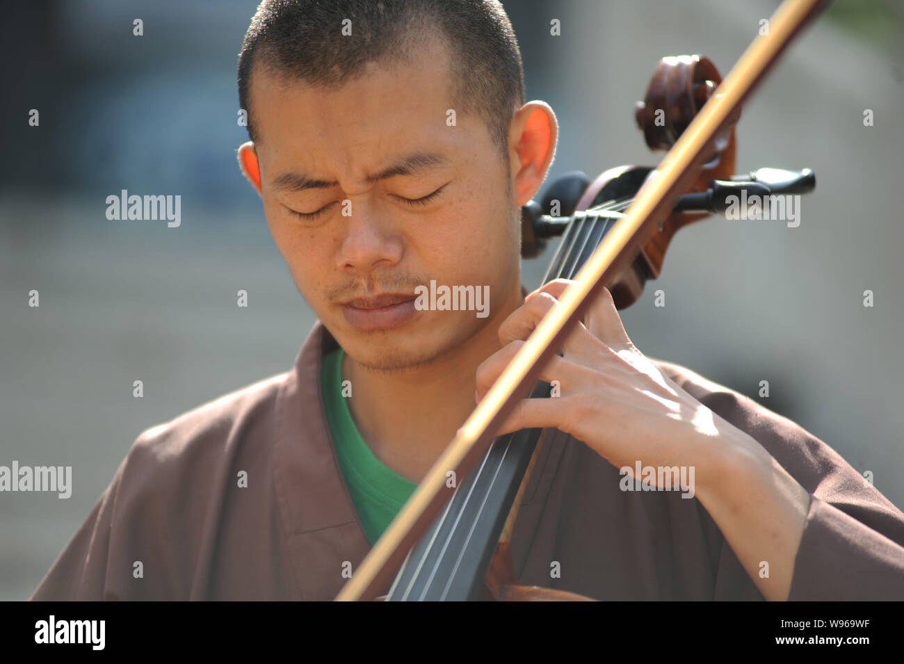 Monk playing cello hi-res stock photography and images - Alamy