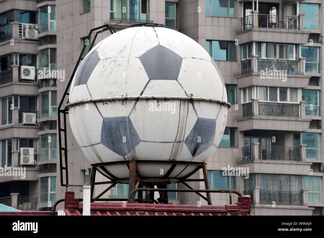 A football-shaped water tank supplying tap water is pictured on the ...