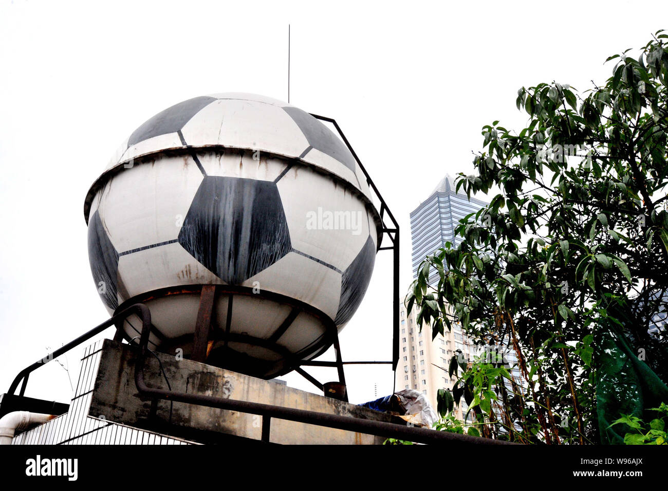 A football-shaped water tank supplying tap water is pictured on the ...