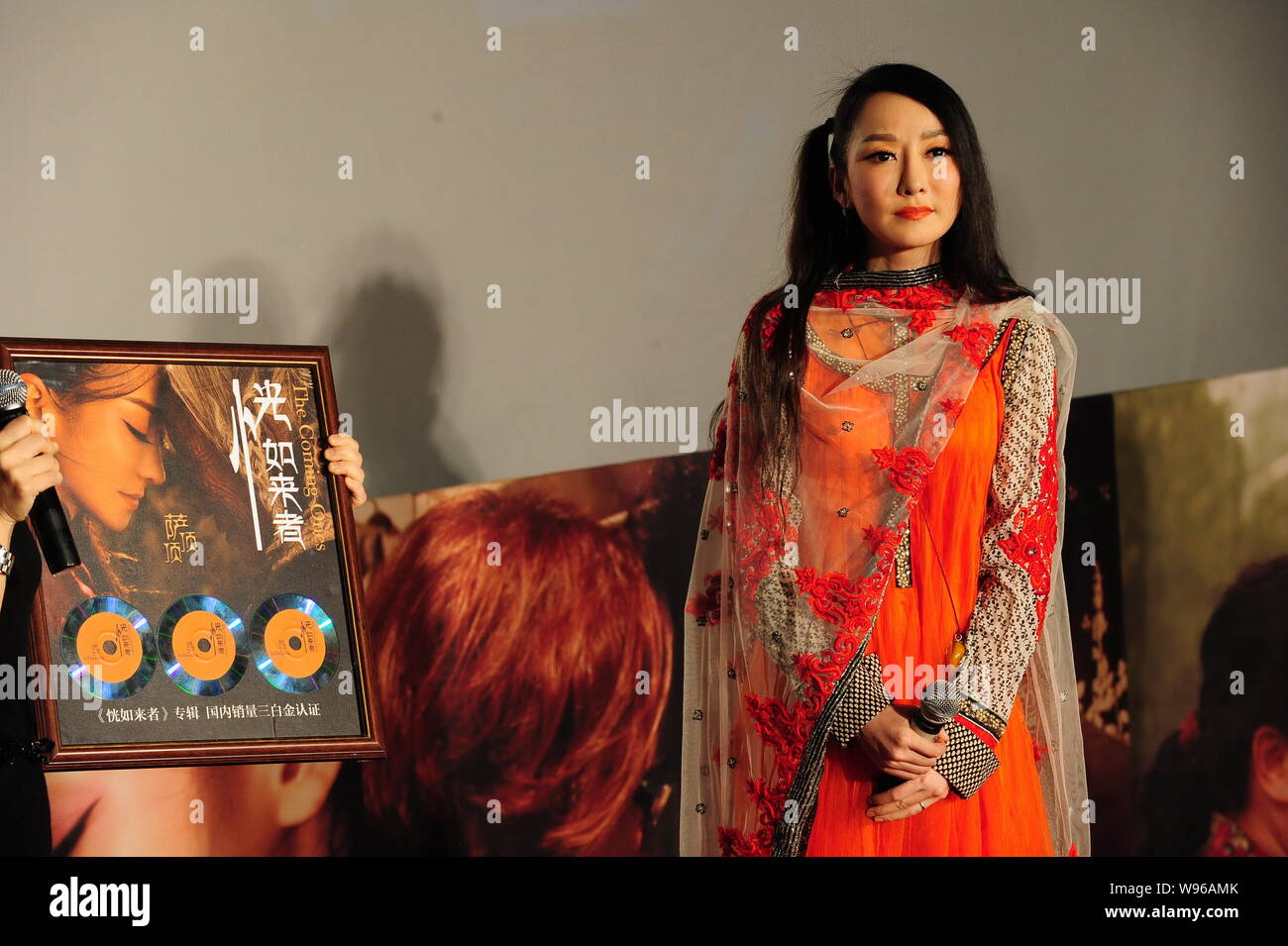 Chinese folk singer Sa Dingding poses during a press conference for her ...