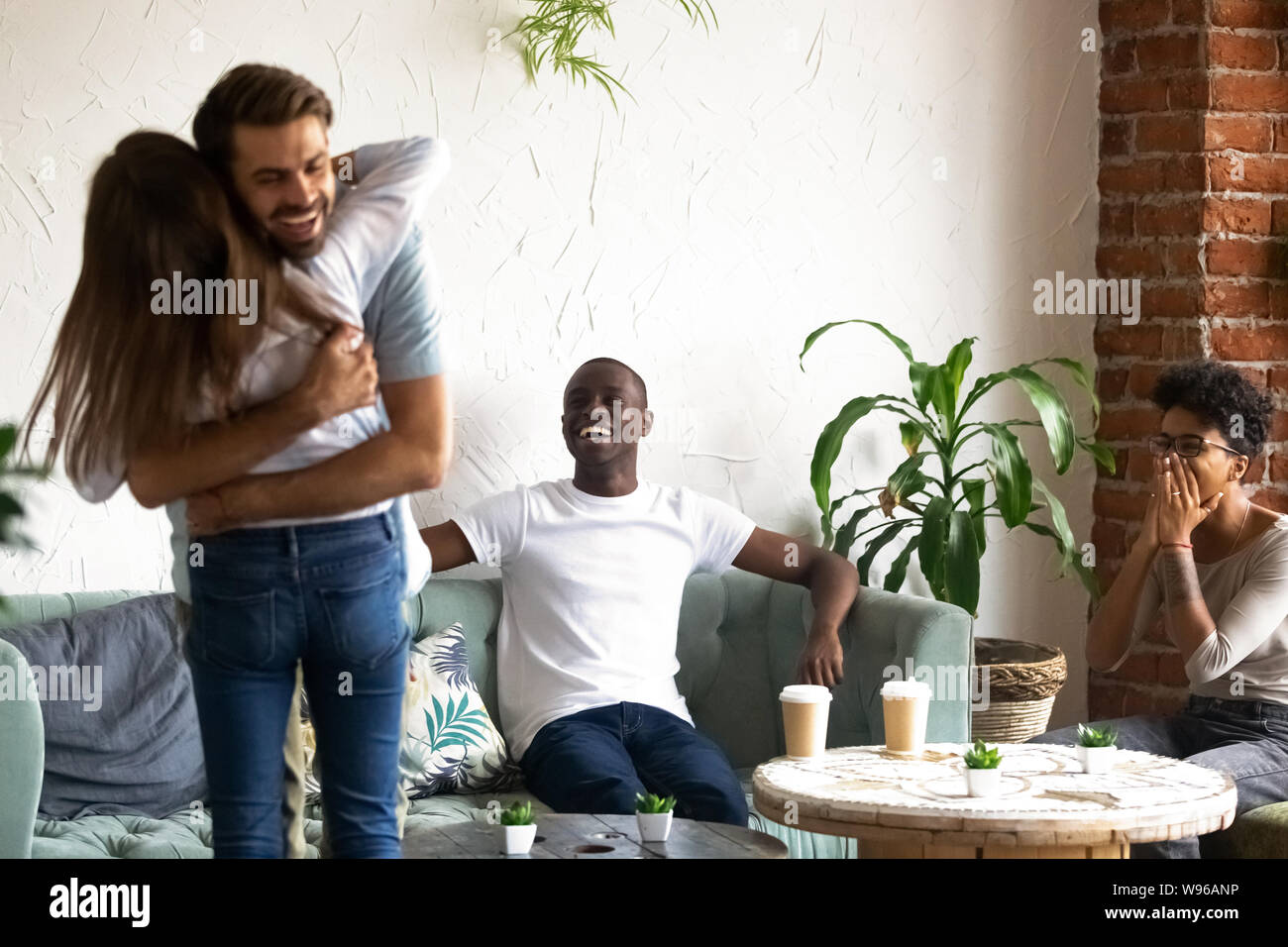 Greeting friends cafe hi-res stock photography and images - Alamy