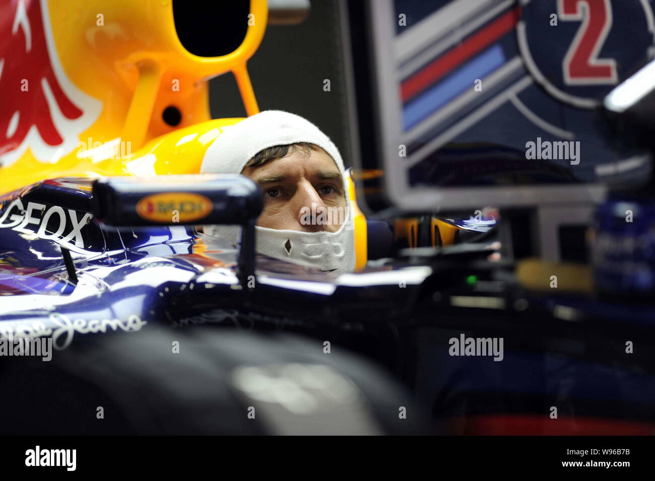 Australian F1 driver Mark Webber of the Red Bull team gets ready for ...