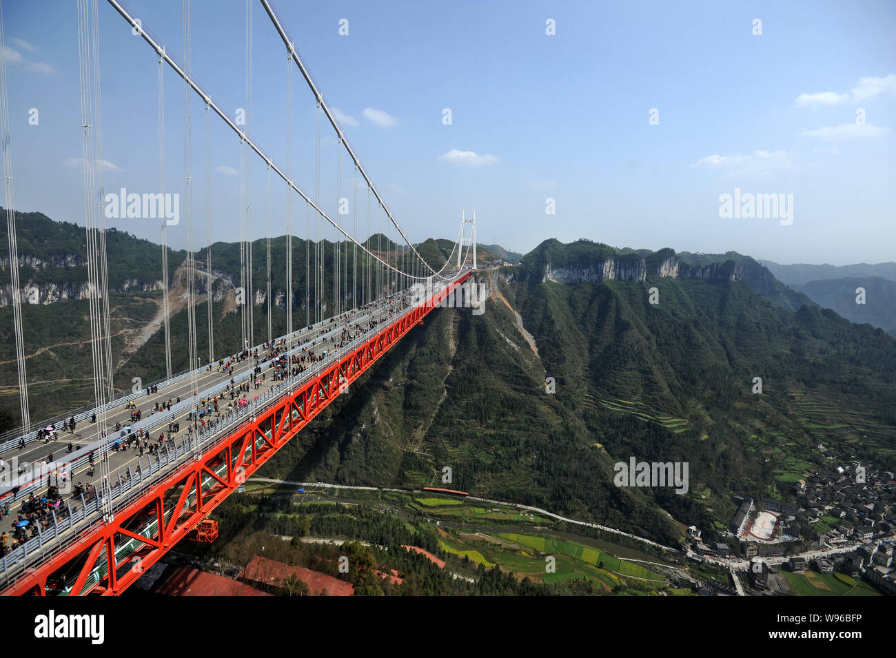 Visitors pass through Aizhai Suspension Bridge in Aizhai town, Jishou ...
