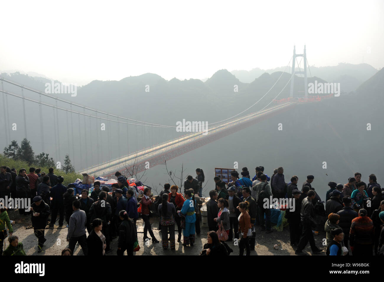 Visitors look at Aizhai Suspension Bridge in Aizhai town, Jishou city ...