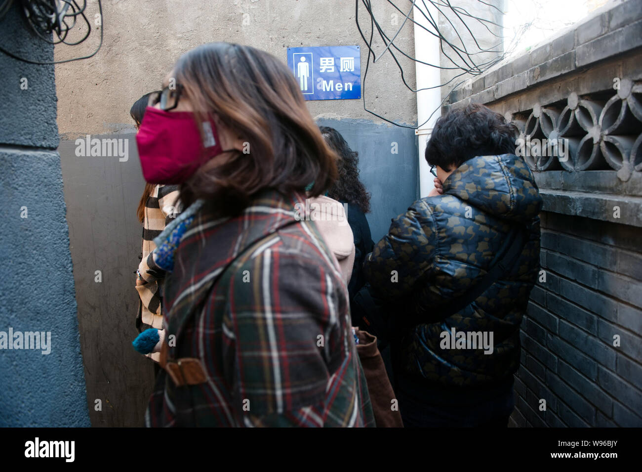 Chinese women line up at a mens toilet during the Occupying Toilets ...