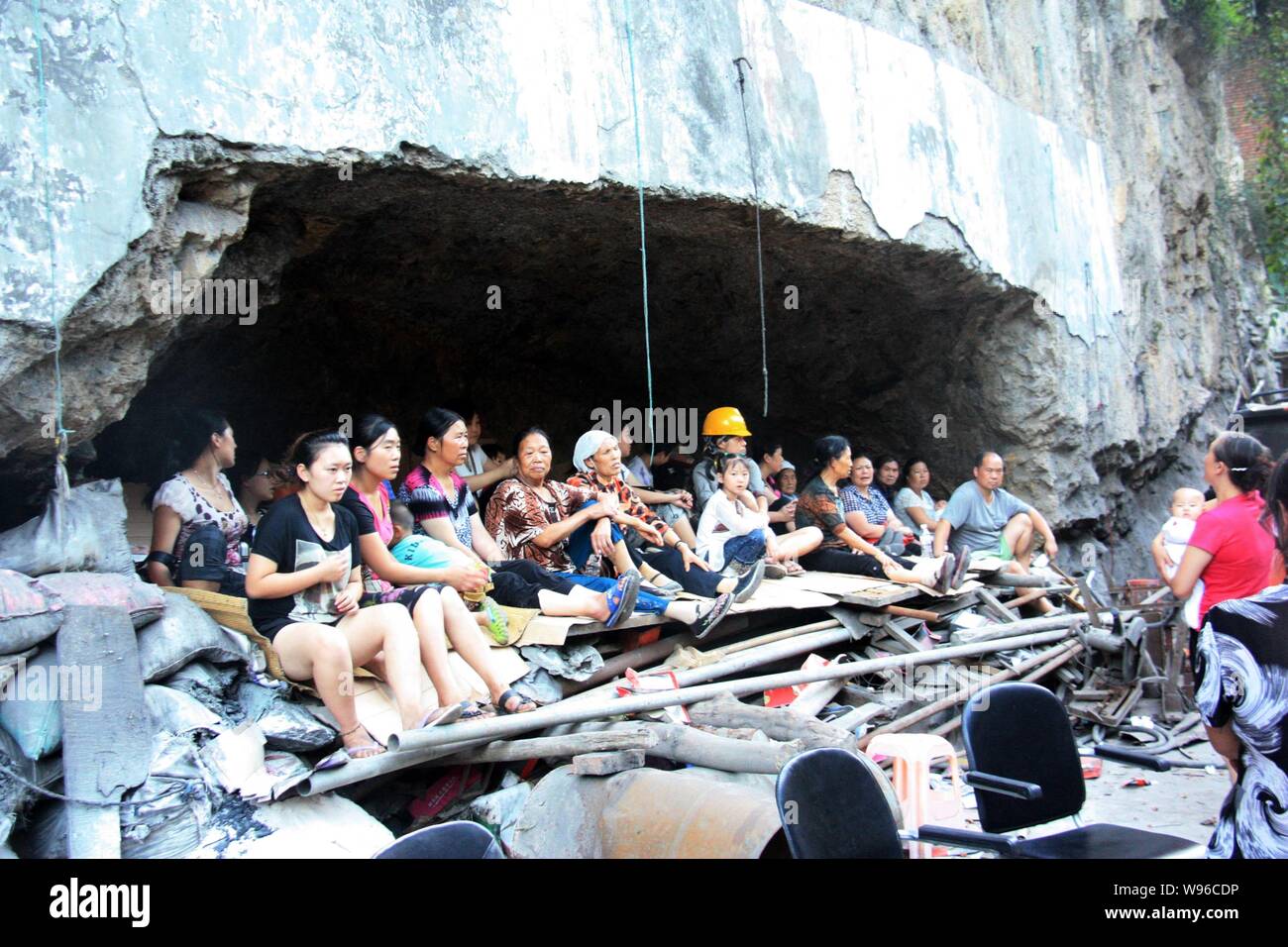 Local villagers affected by the 5.6-magnitude earthquake rest in a mine ...