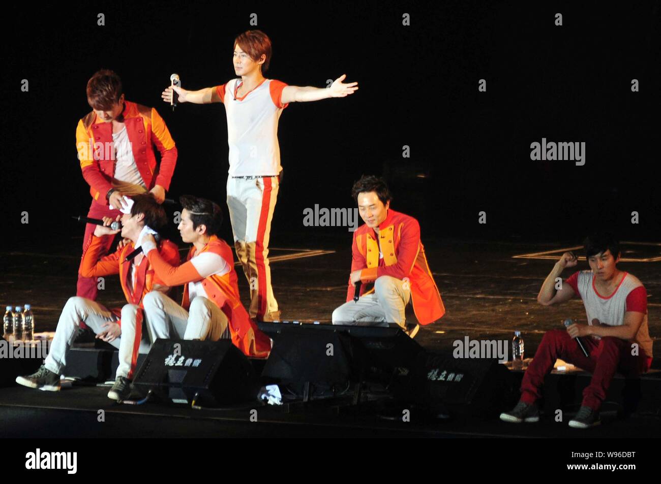 Members of South Korean boy band Shinhwa perform during their concert ...