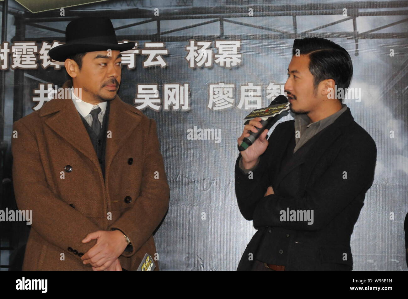 Hong Kong actor Nicholas Tse (R) speaks during a press conference for ...