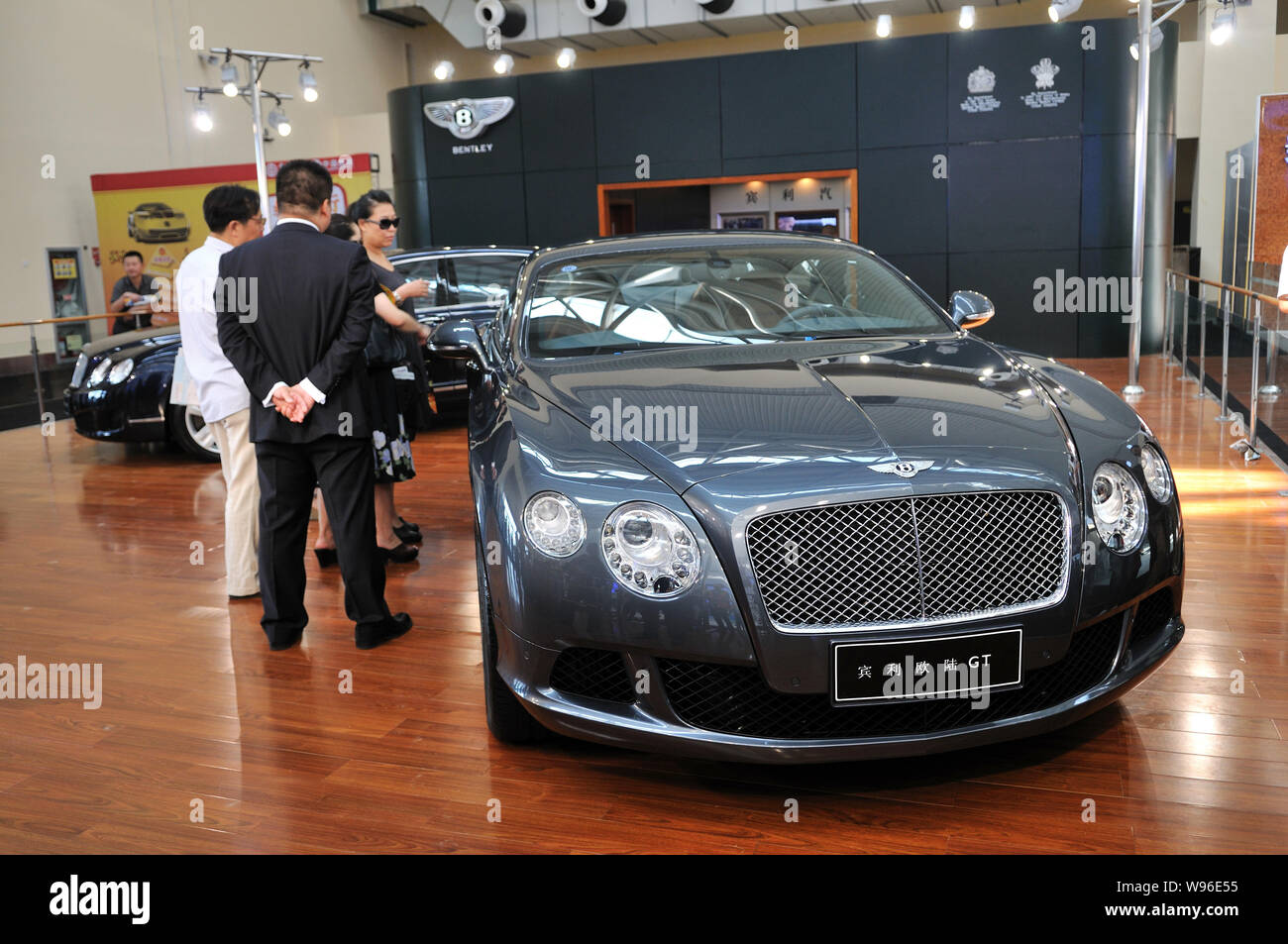 --FILE--Car buyers look at a Bentley Continental GT during an auto show ...