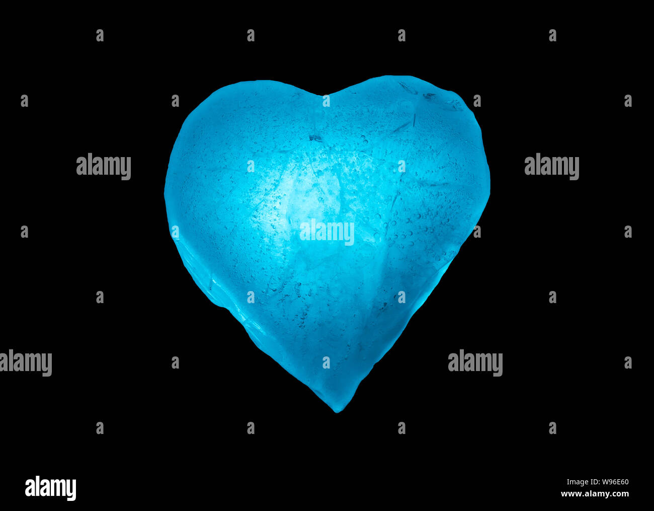 Close-up blue ice frozen heart symbol isolated on a black background ...