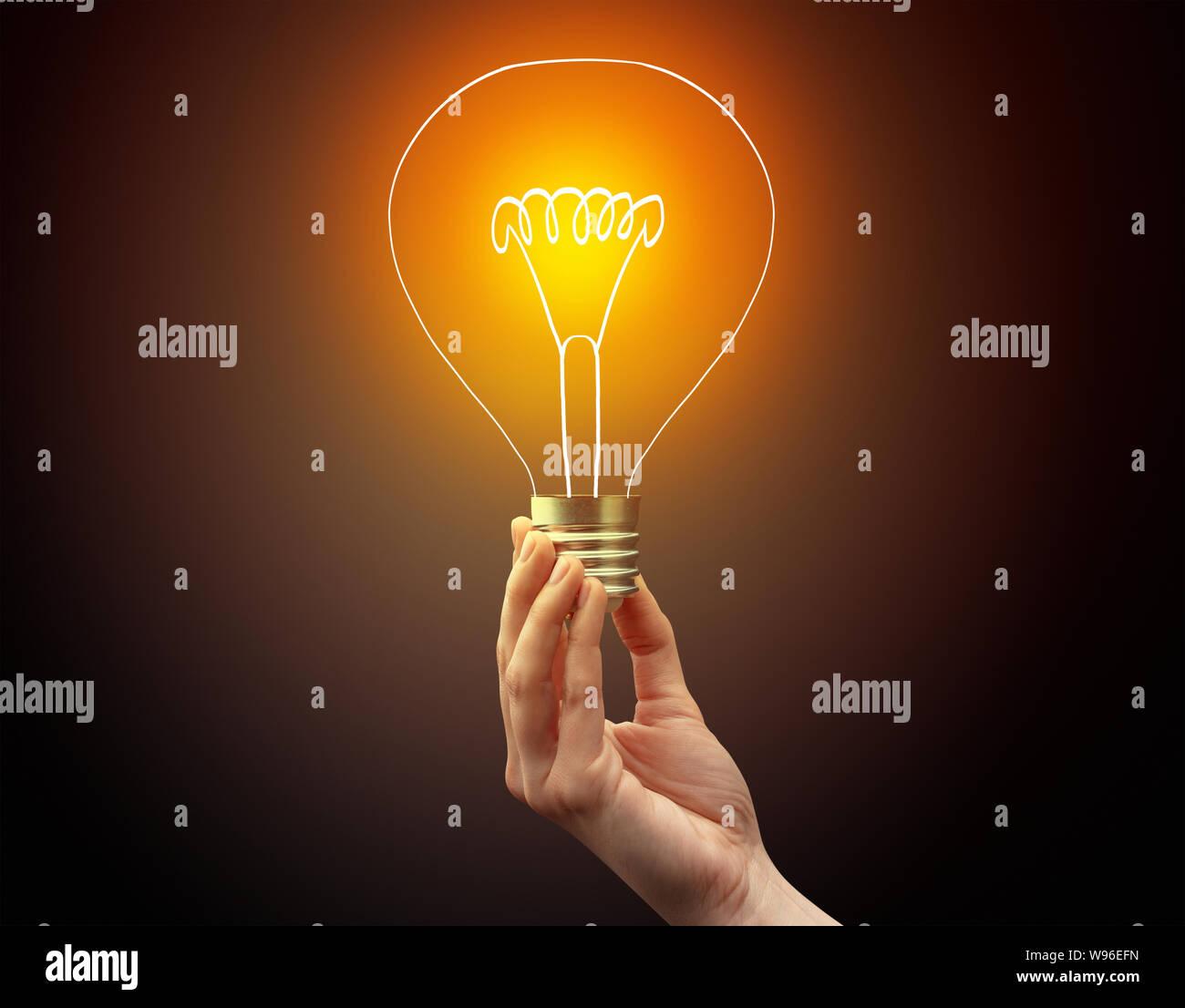Hand holding light bulb on dark background, new idea concept Stock ...