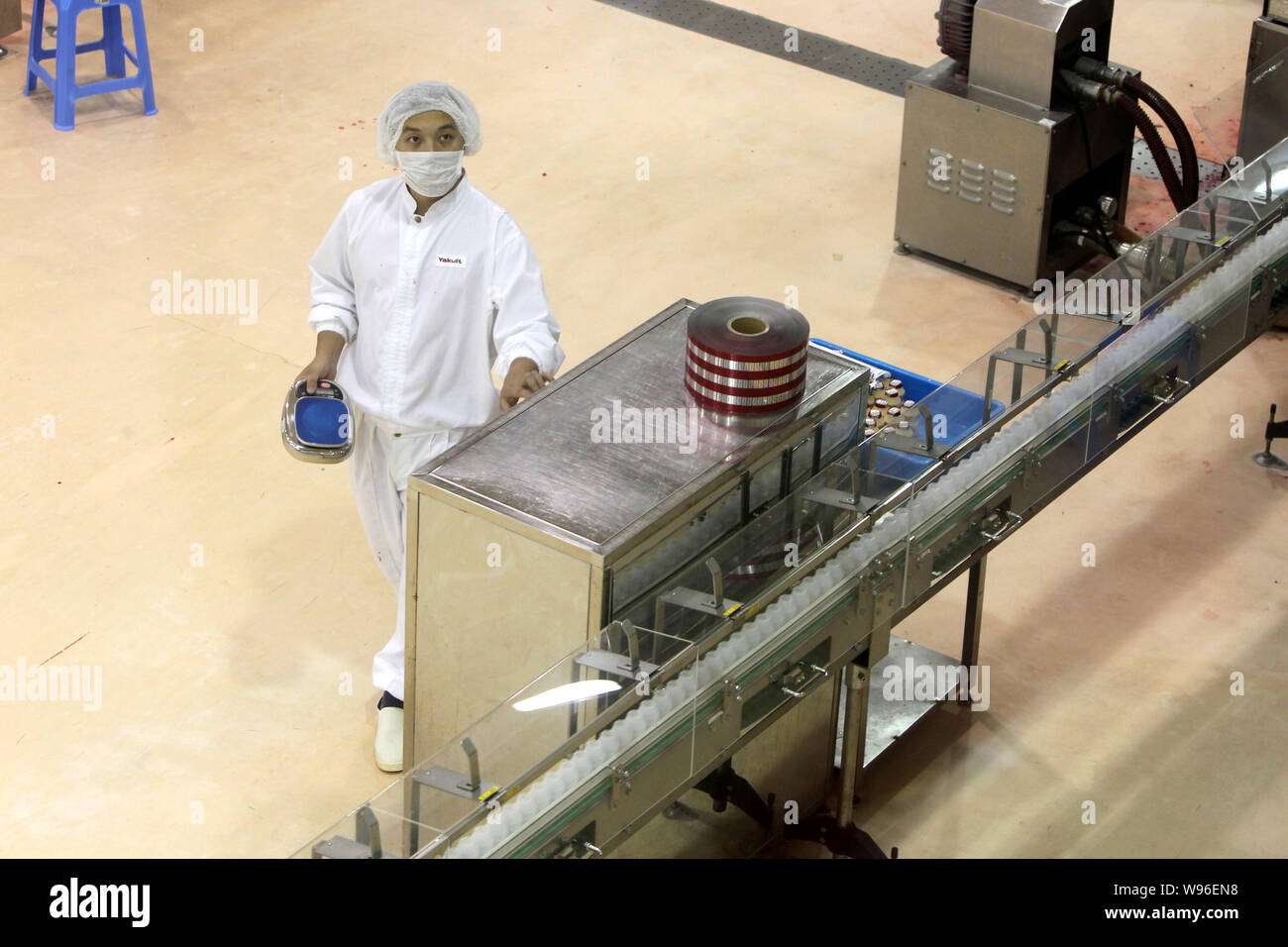 Yakult factory worker hi-res stock photography and images - Alamy