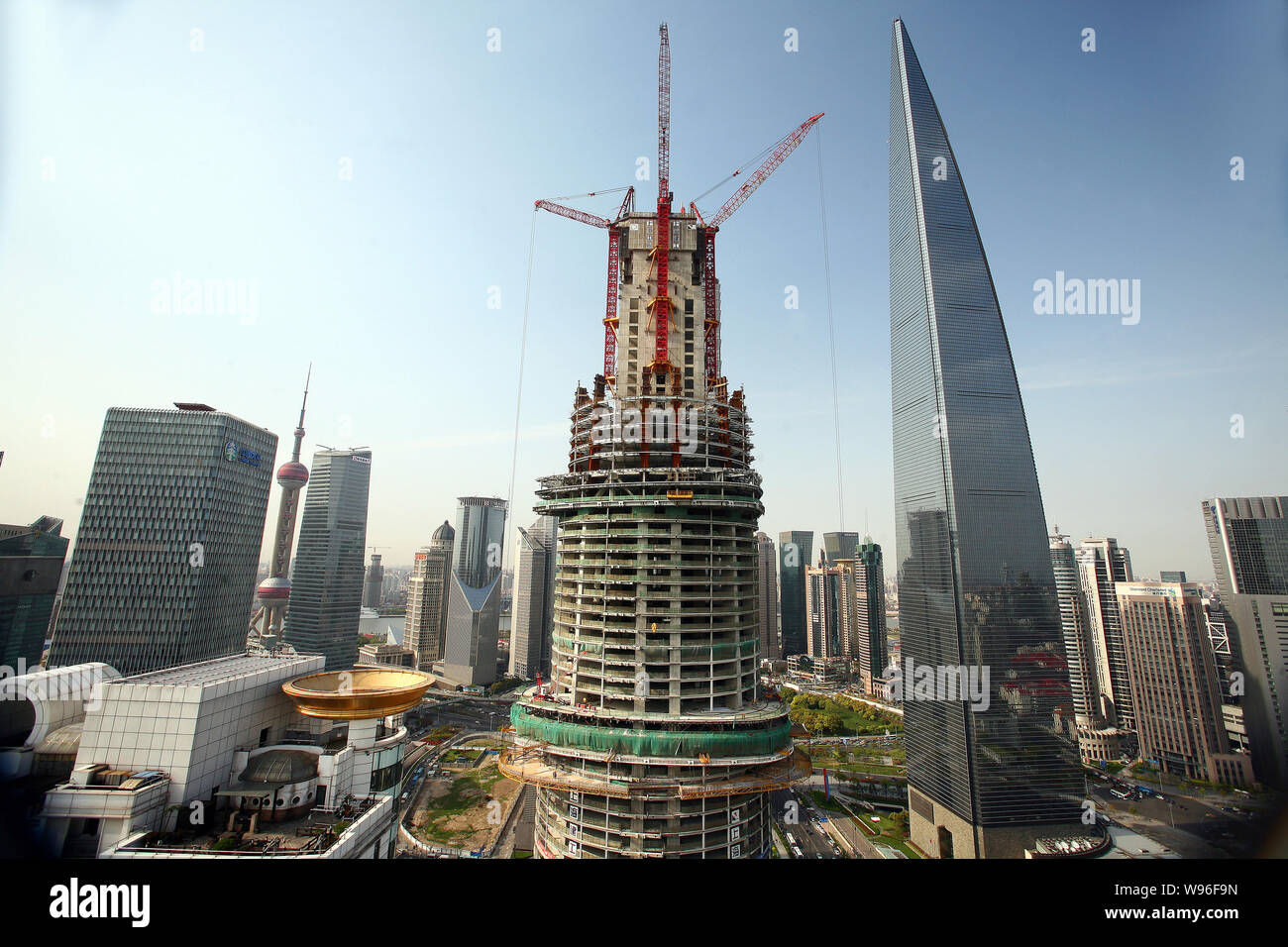 The Shanghai Tower is under construction next to the Shanghai World ...