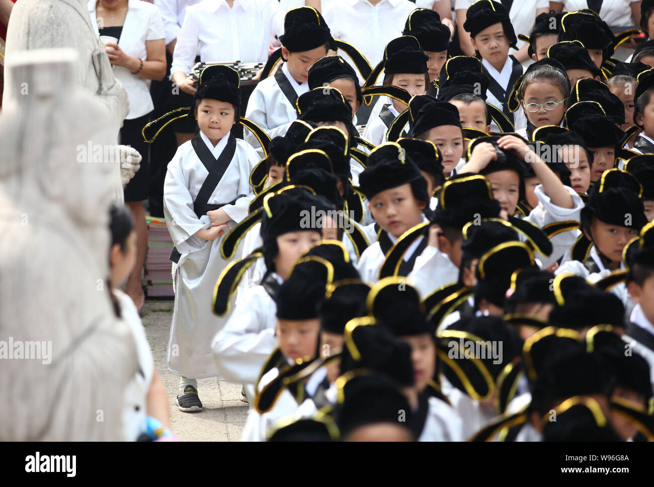 Newly enrolled primary school students, dressed in traditional Chinese ...