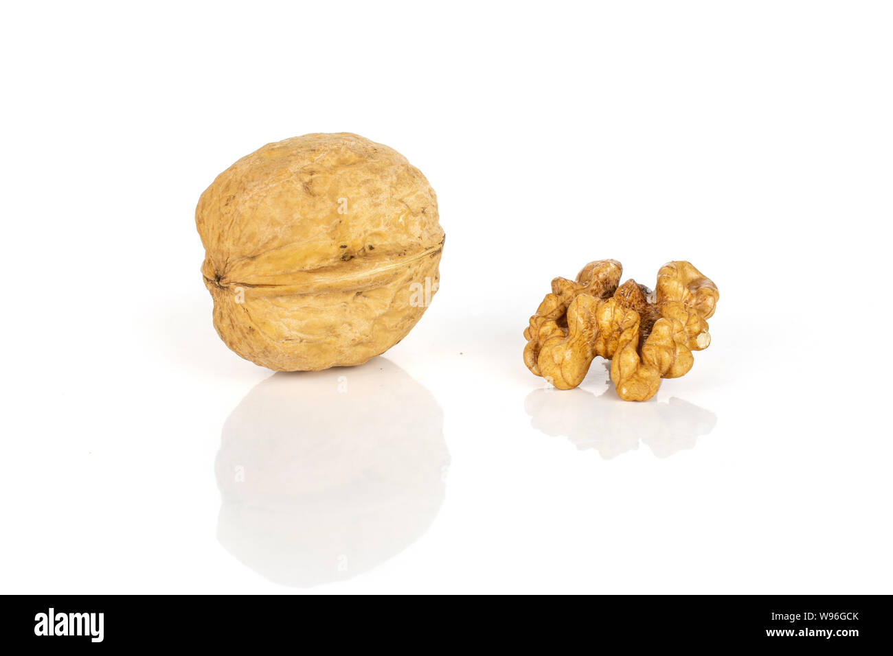 Group of one whole one half of ripe brown walnut isolated on white ...