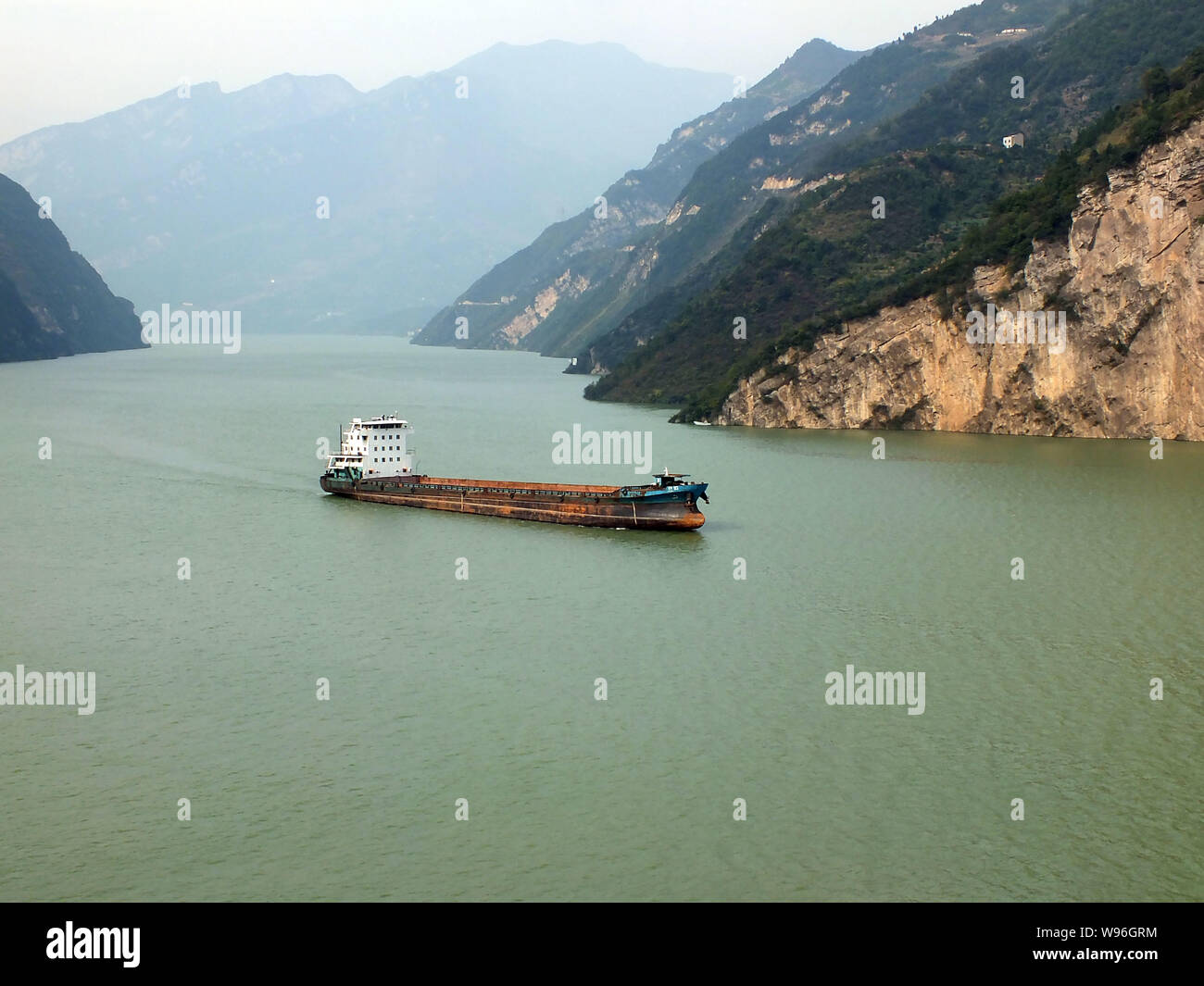 A cargo ship sails on the Yangtze River in Xiling Gorge after the water ...