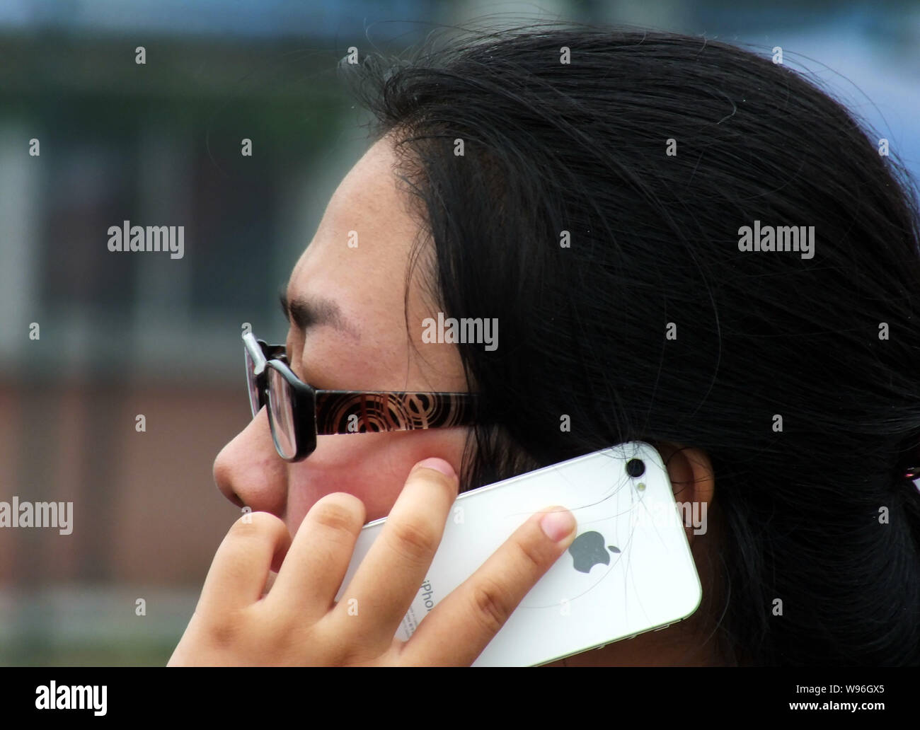 Woman seen using iphone hi-res stock photography and images - Alamy