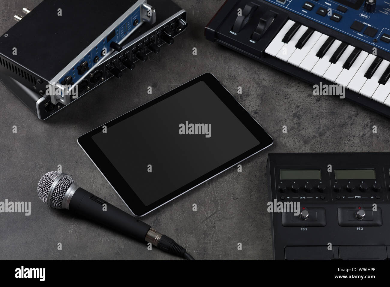 Empty tablet and electronic music instruments Stock Photo - Alamy