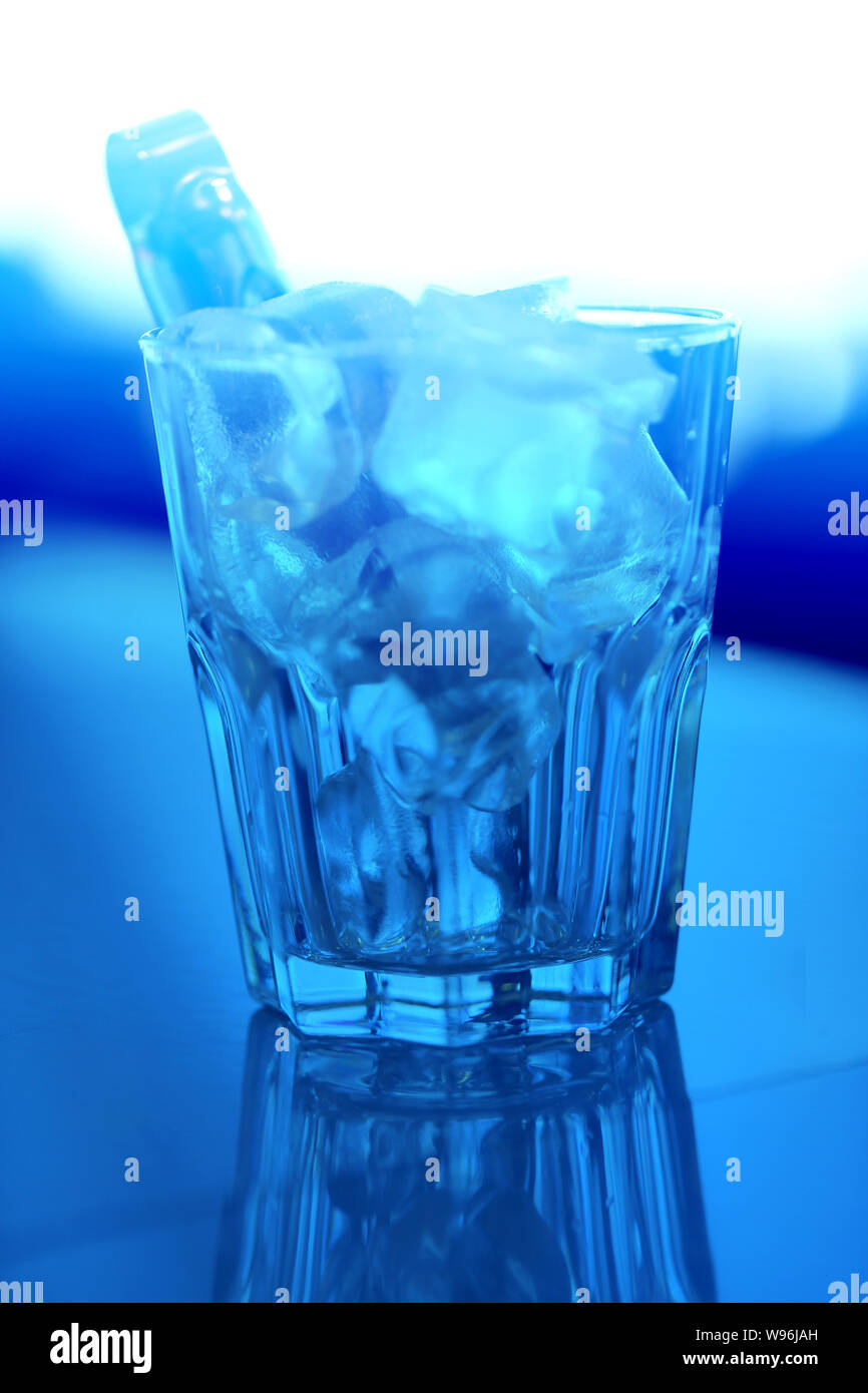Macro photo of blue coarse ice in a transparent glass in a cafe Stock ...