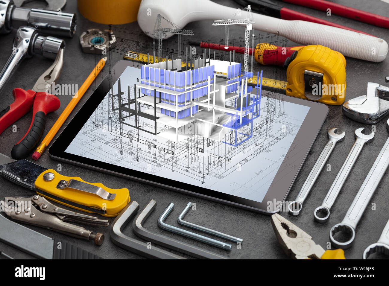 Tablet with construction tools and 3d house plan concept Stock Photo ...
