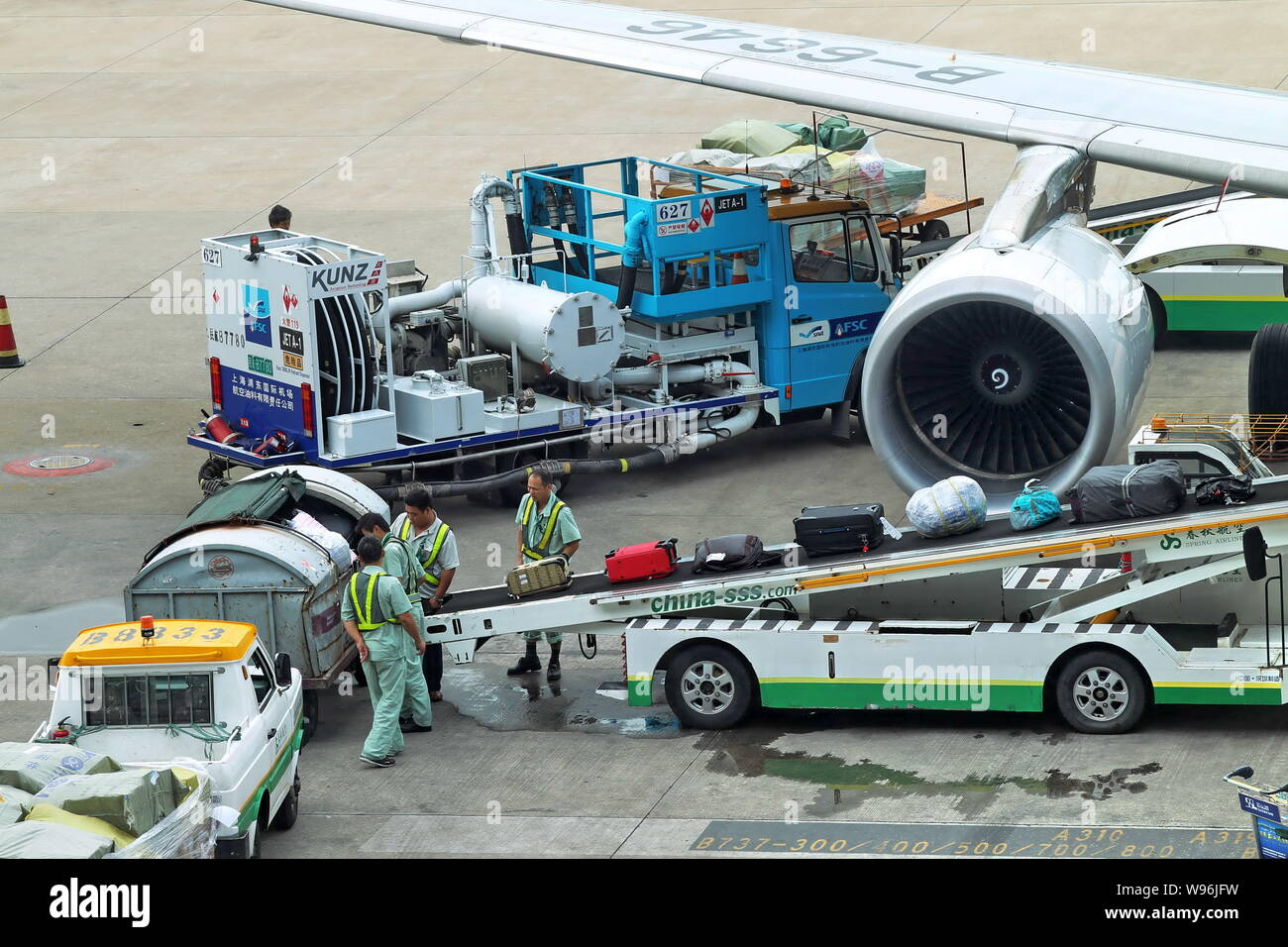 Passengers lugguge are pictured as being offloaded from a plane at ...