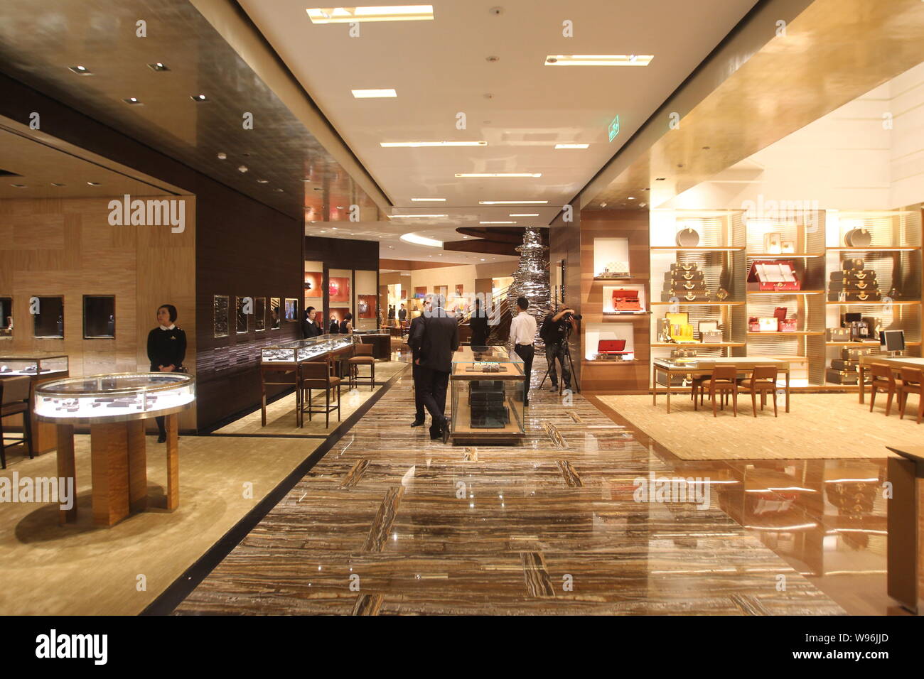 Visitors are seen at the new flagship store of Louis Vuitton including ...