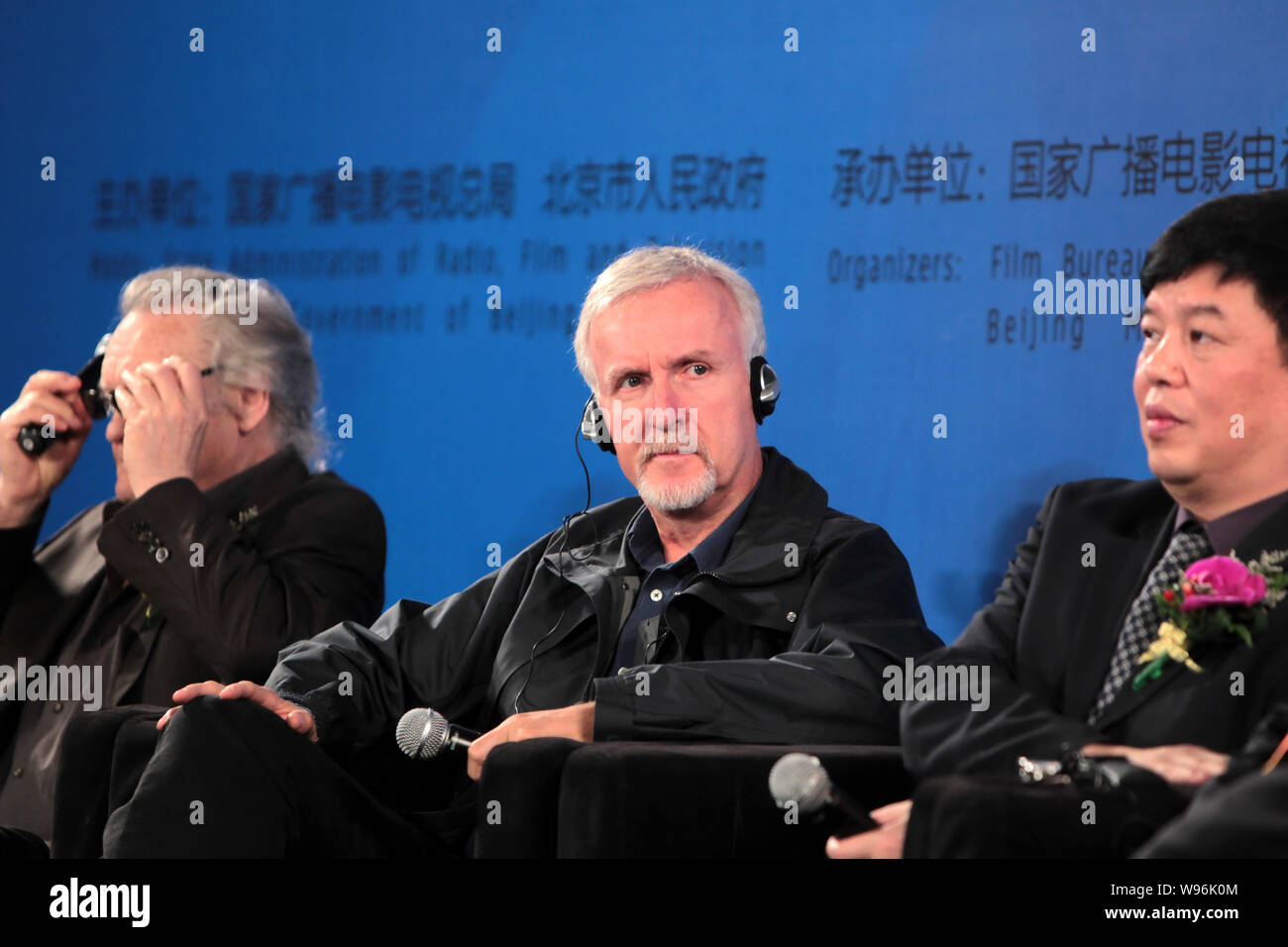 Canadian film director and producer James Cameron, center, attends a ...