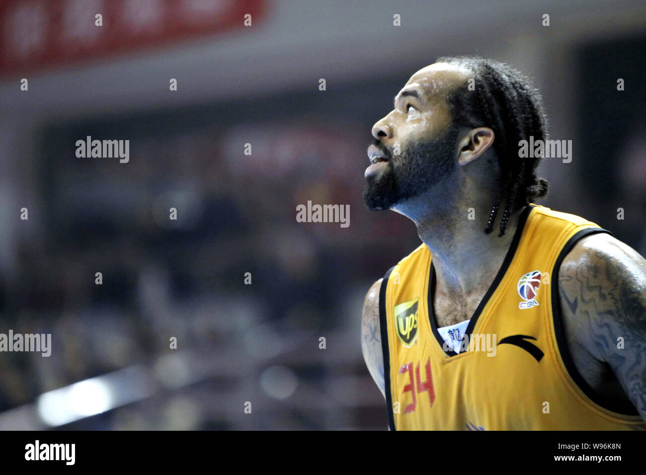 Charles Gaines of Shanxi Zhongyu looks on while competing against ...