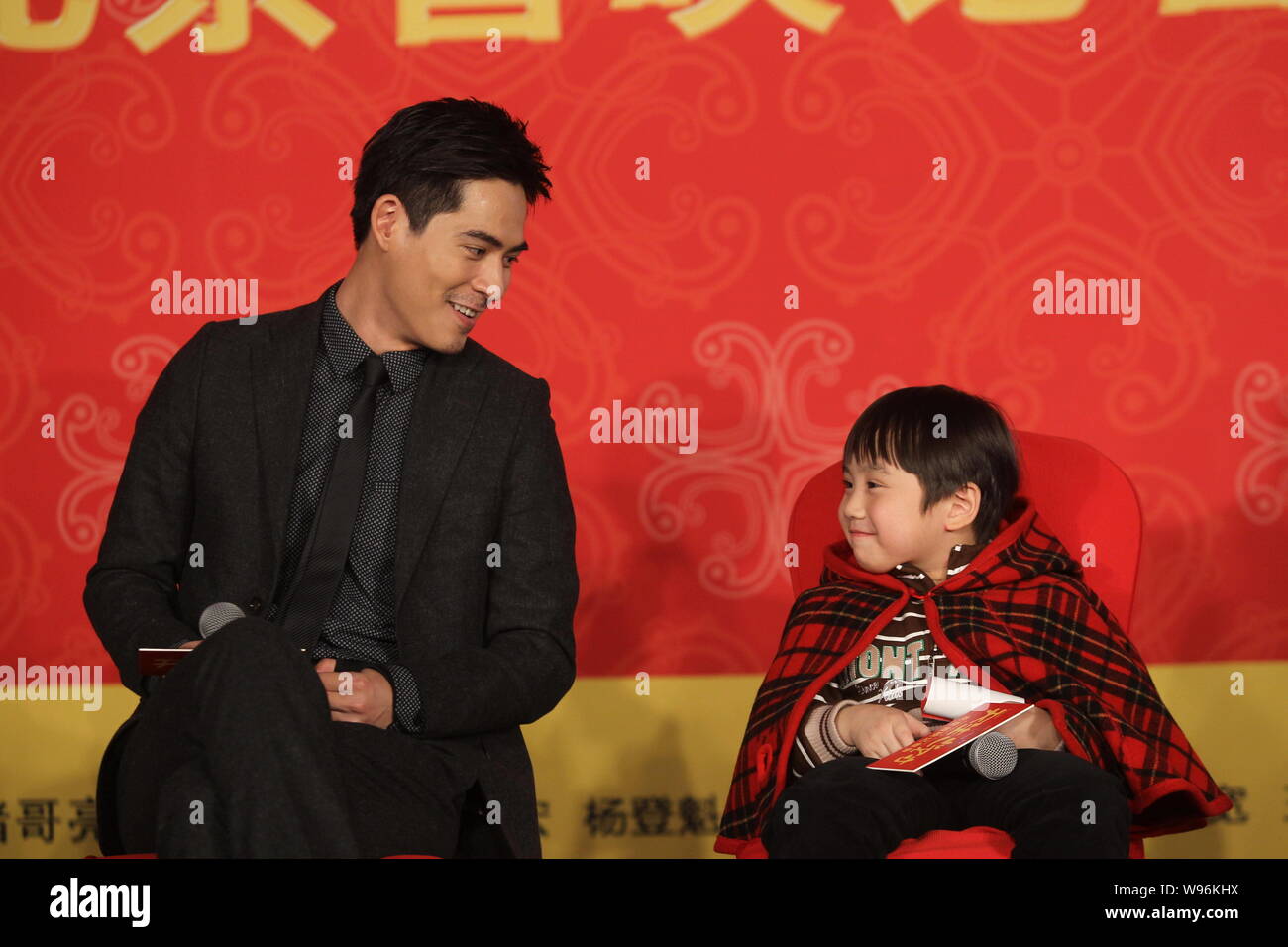 Taiwanese actor and singer Vic Chou looks at his son in the movie ...