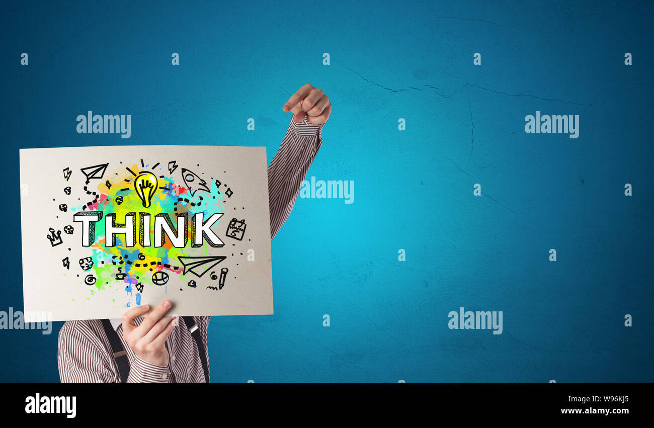 Young person holding paper with design thinking concept Stock Photo - Alamy