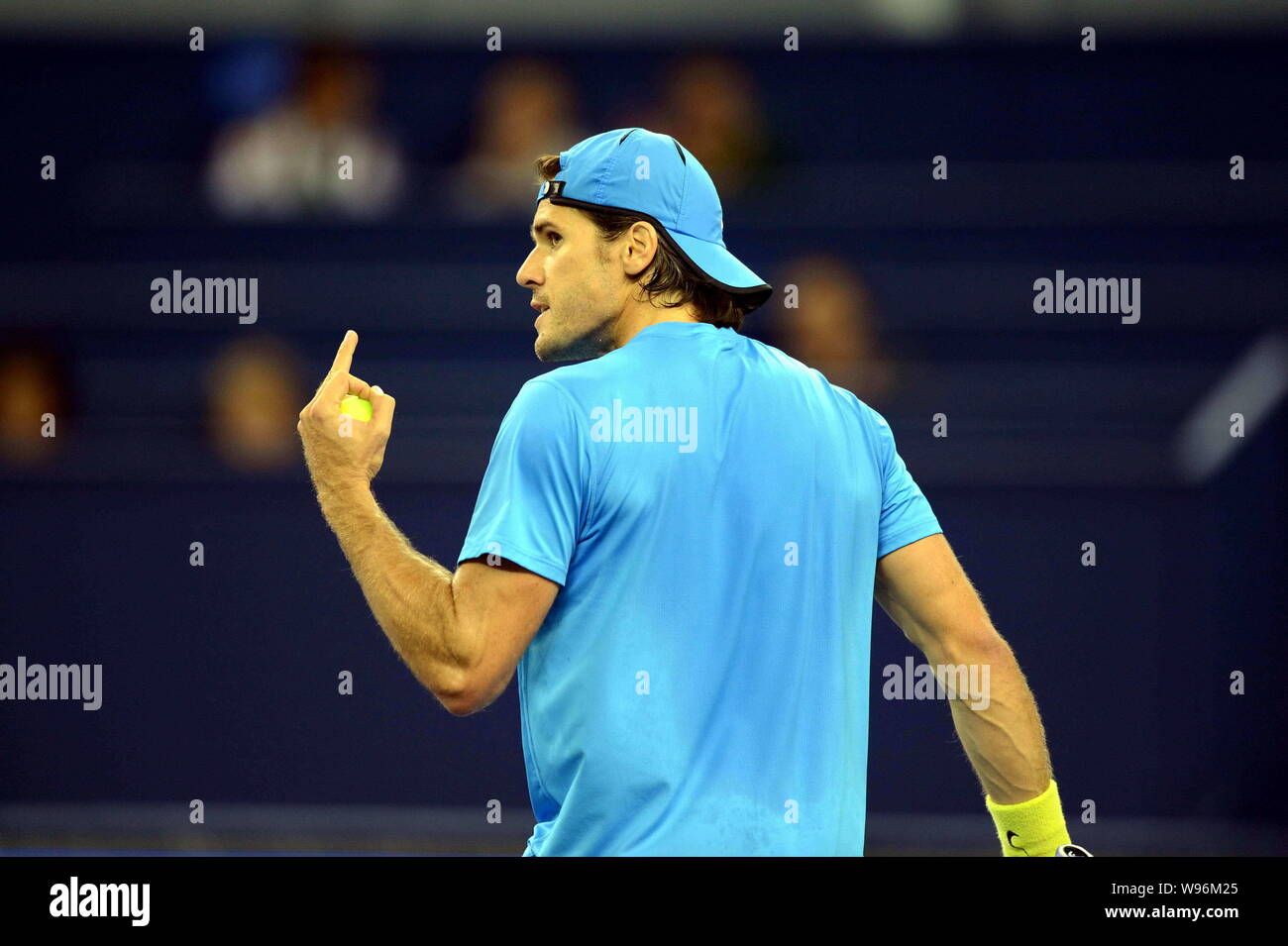 Tommy Haas of Germany shows a middle finger to the judge as he competes ...