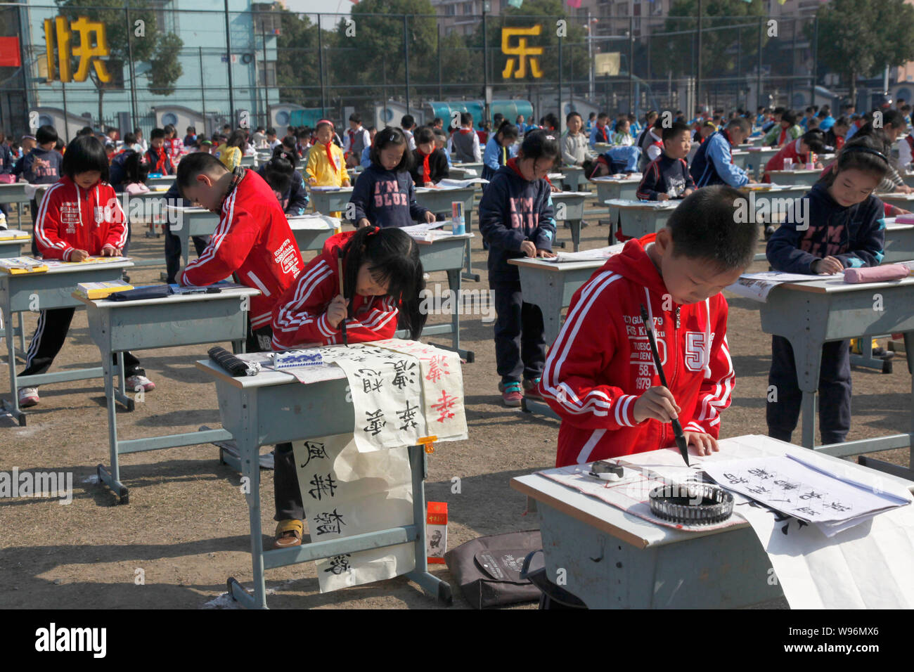 Young Chinese students write calligraphy and paint durin an event to ...