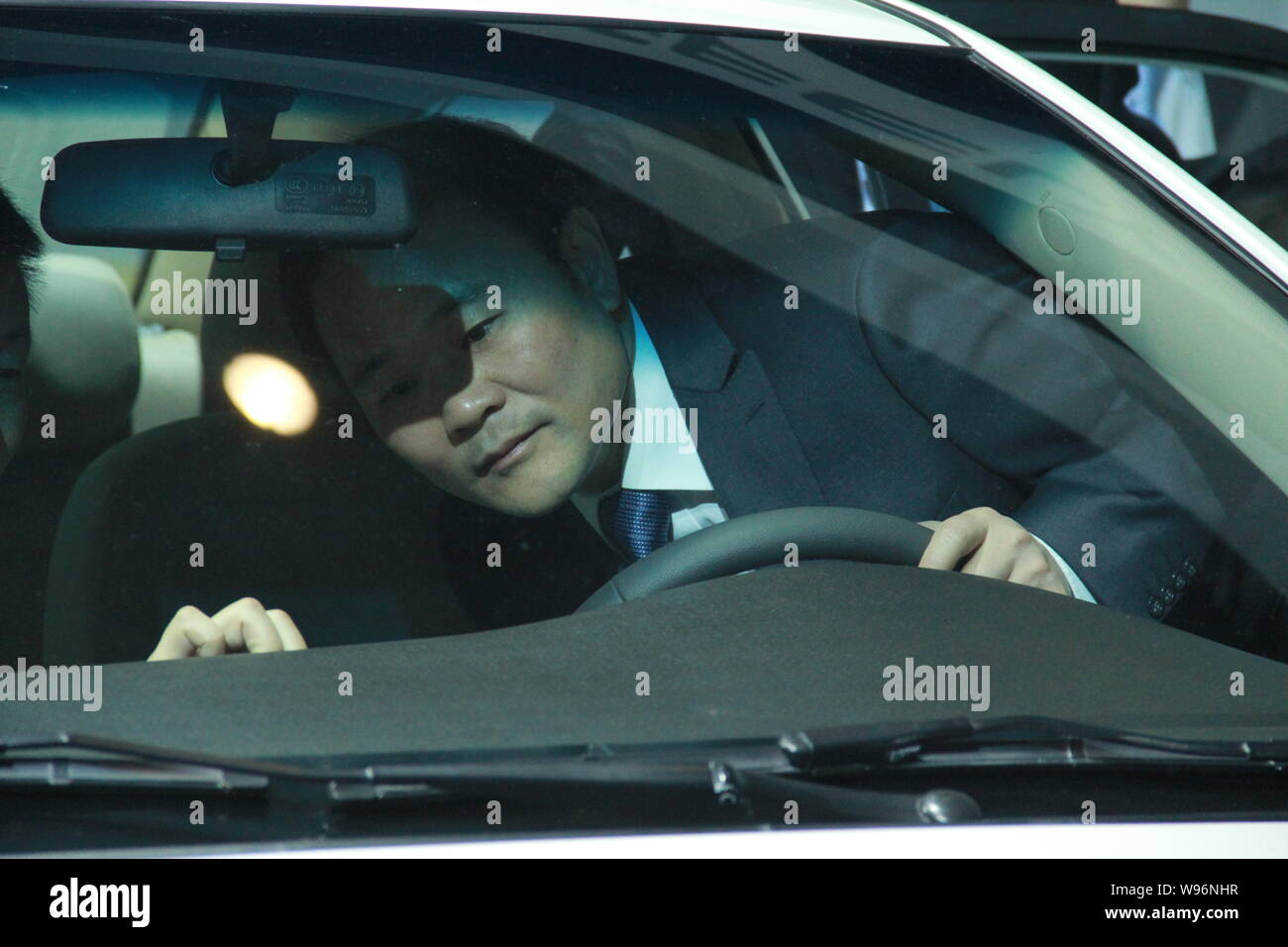 Li Shufu, Chairman of Zhejiang Geely Holding Group Co. Ltd., looks at a ...