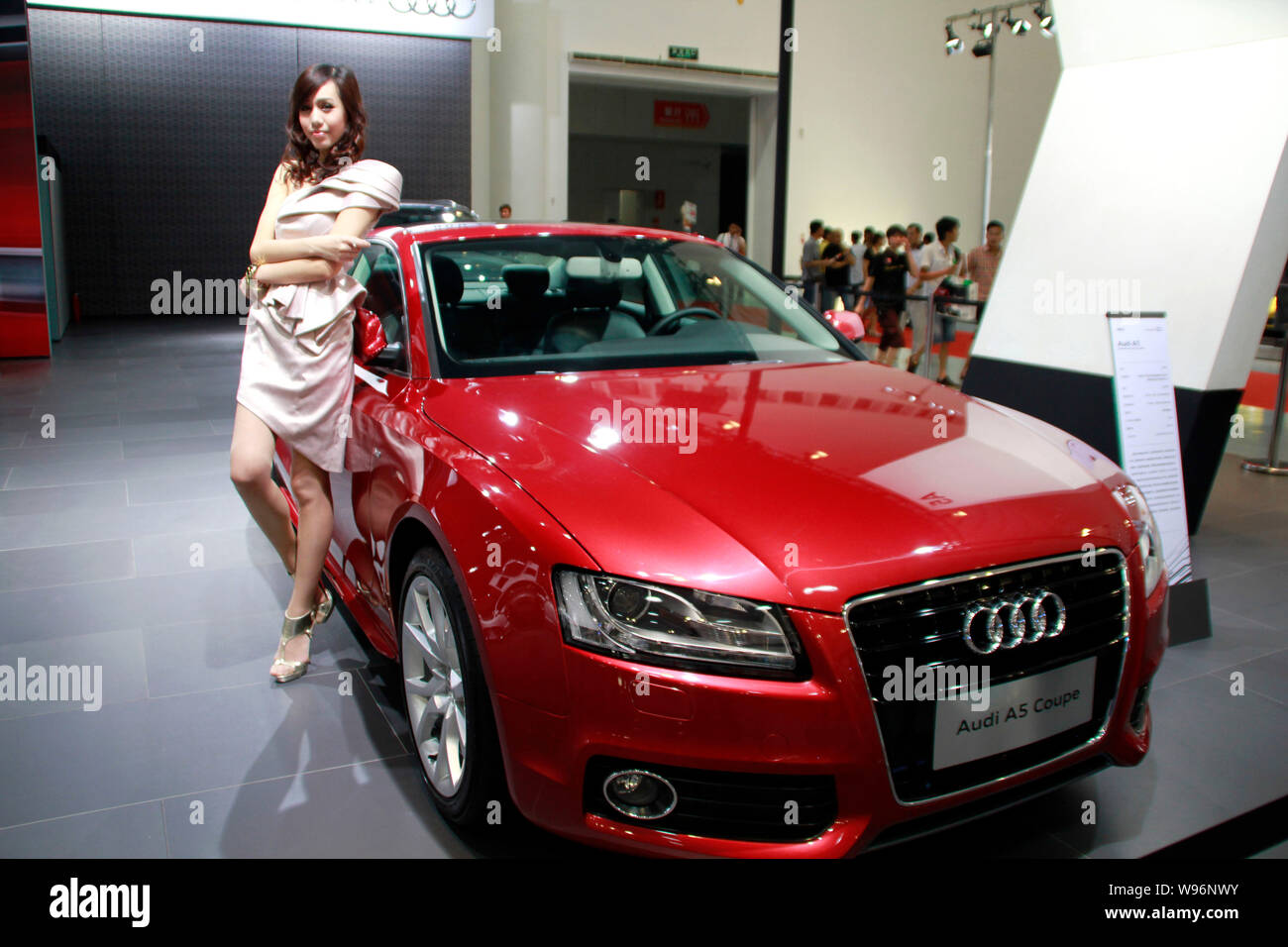 --File--A model poses by an Audi car during an auto show in Haikou city ...