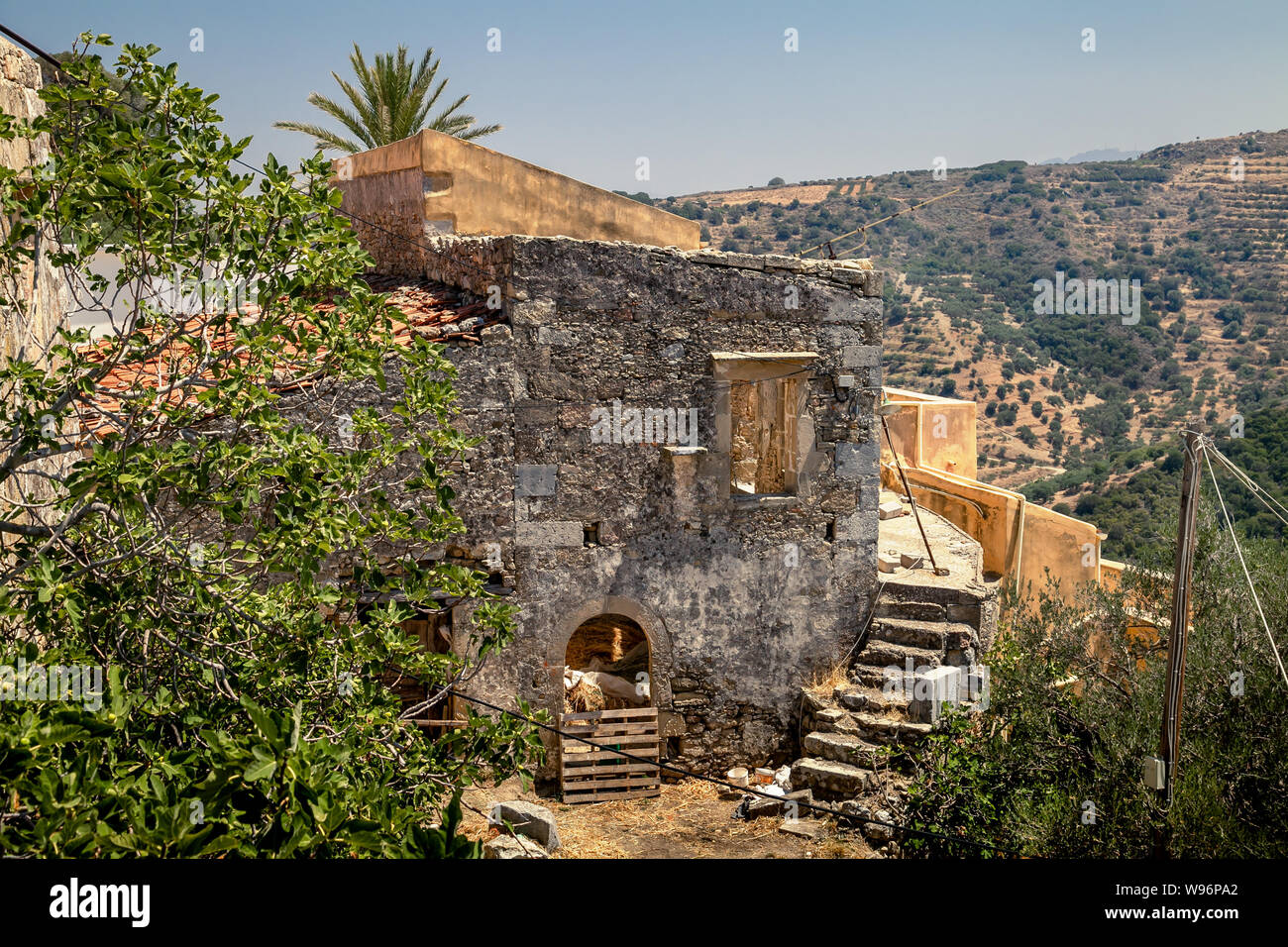 The ancient ruins in the mountain village of Polirinia. Greece. Crete ...
