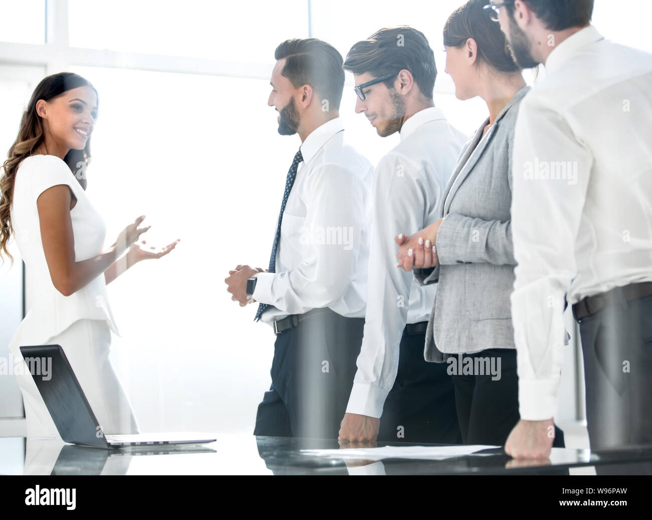 business team looks out the office window Stock Photo - Alamy