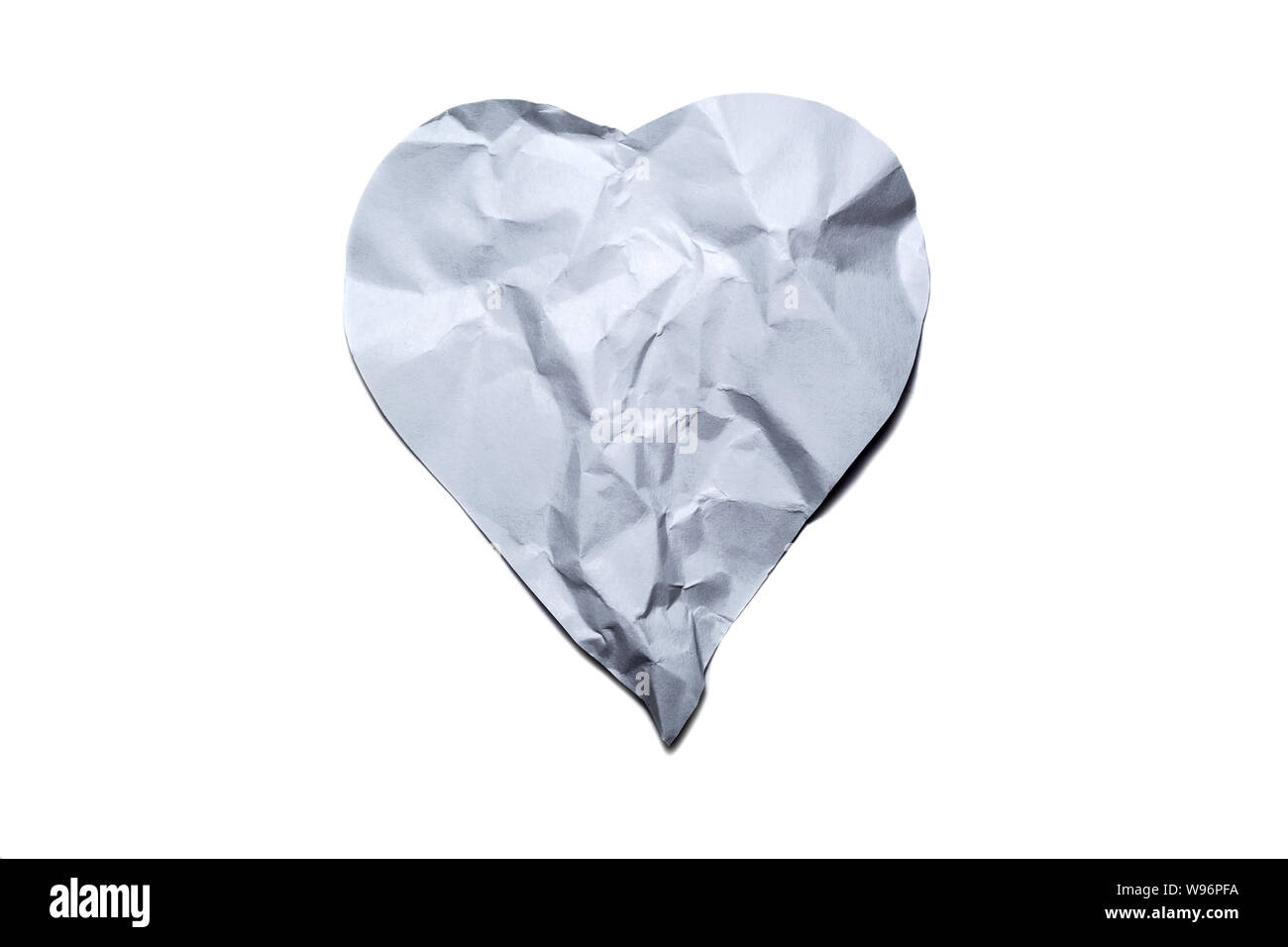 Heart symbol from old, crumpled paper isolated on a white background ...