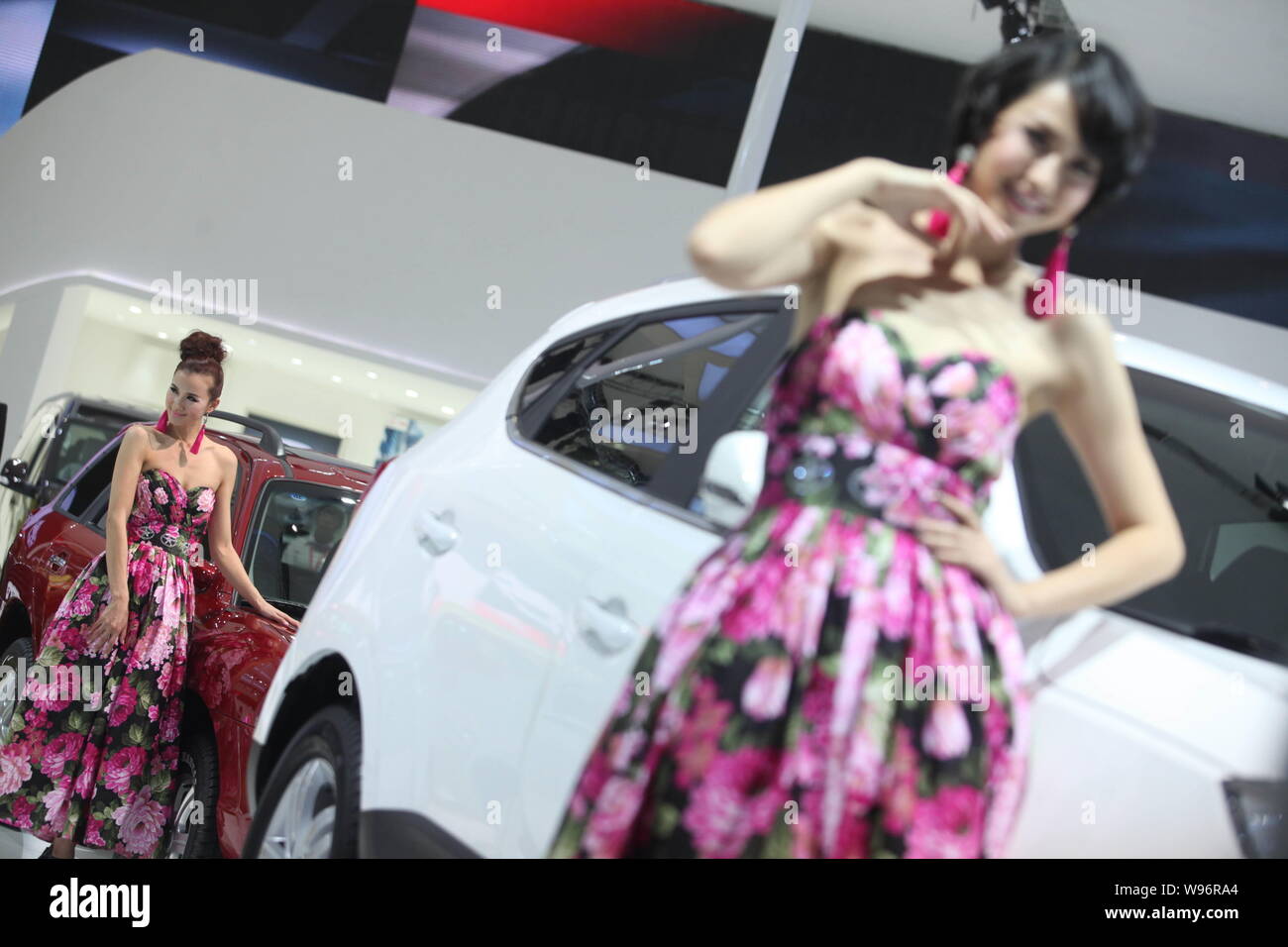 Models pose with cars during the 10th China (Guangzhou) International ...