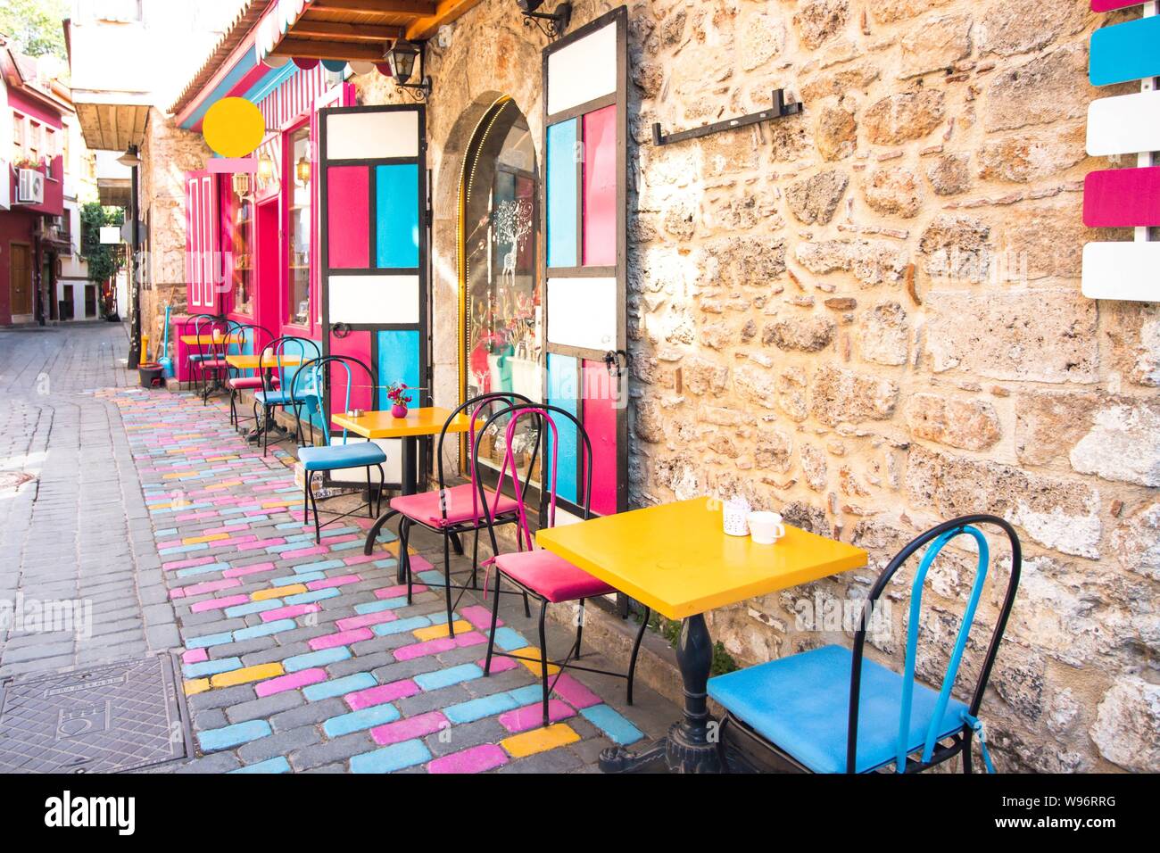 Bright and colorful interior of a cafe on a city street. The narrow ...