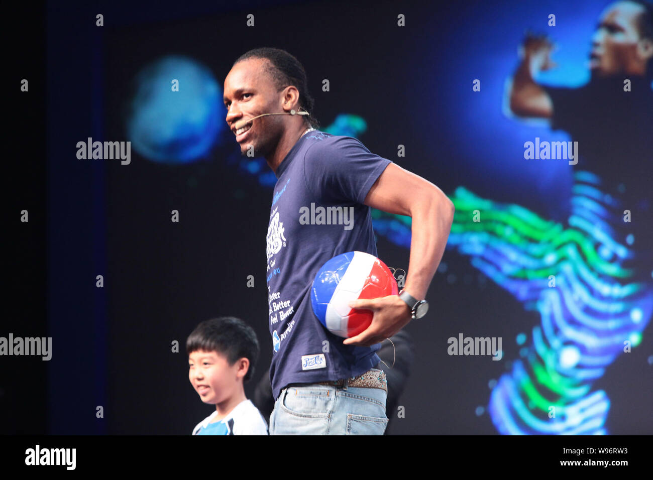 Didier Drogba of Shanghai Shenhua FC reacts at a promotional event and ...
