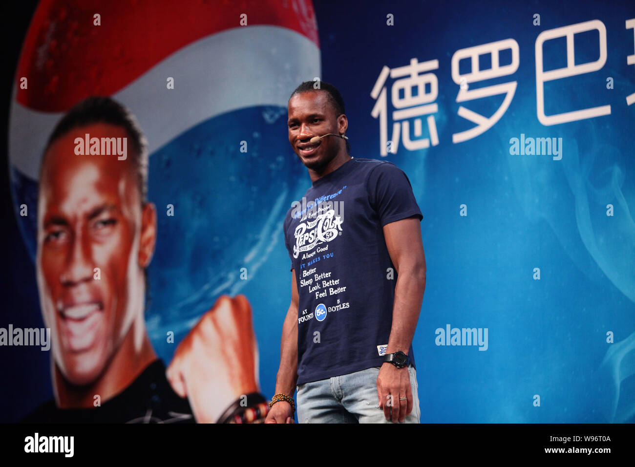 Didier Drogba of Shanghai Shenhua FC poses at a promotional event and ...